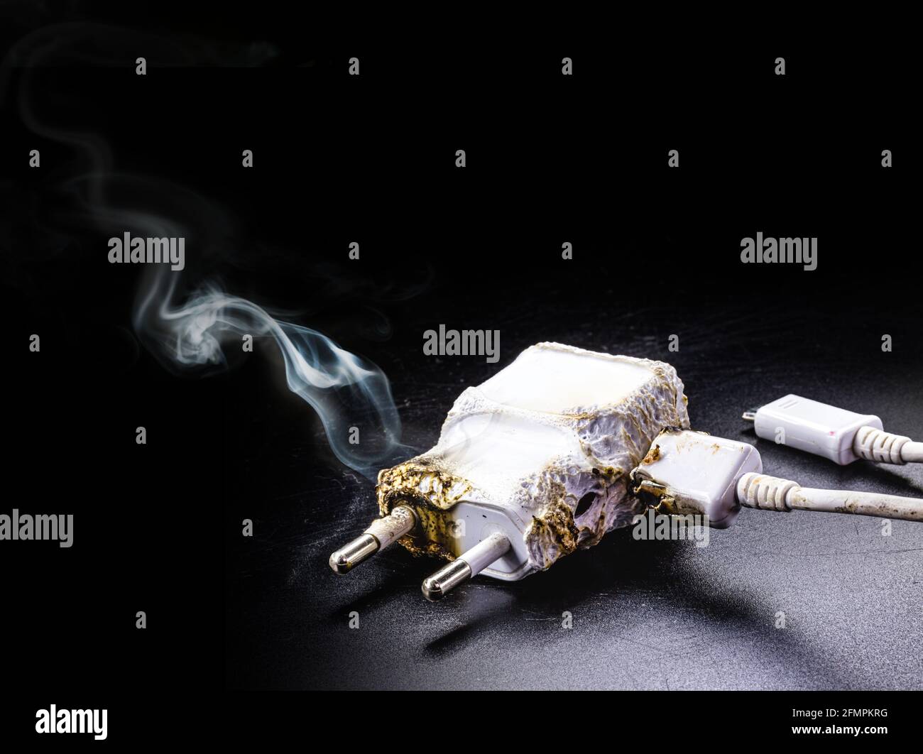 broken smartphone charger, charred after short circuit Stock Photo - Alamy