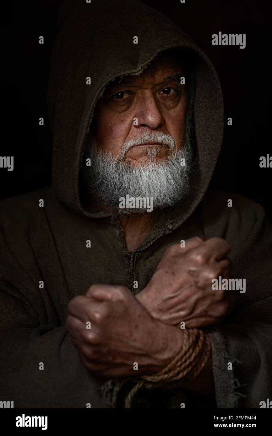 shackled old man with middle ages time Stock Photo - Alamy