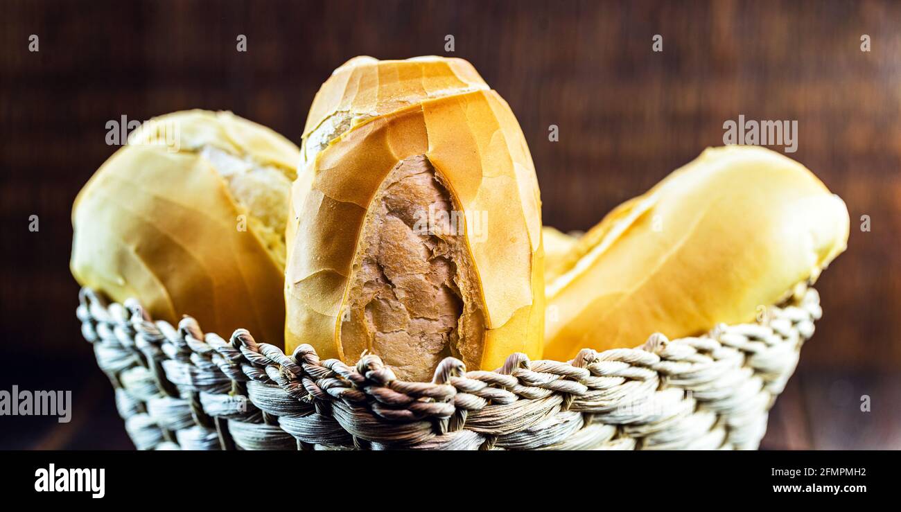 salty bread from Brazilian bakery, called French bread, in basket with ...