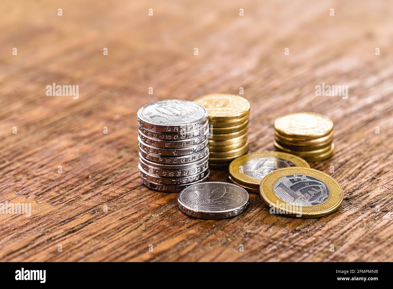 coins from brazil, stack of 1 real coins, 50 cents and other values ...