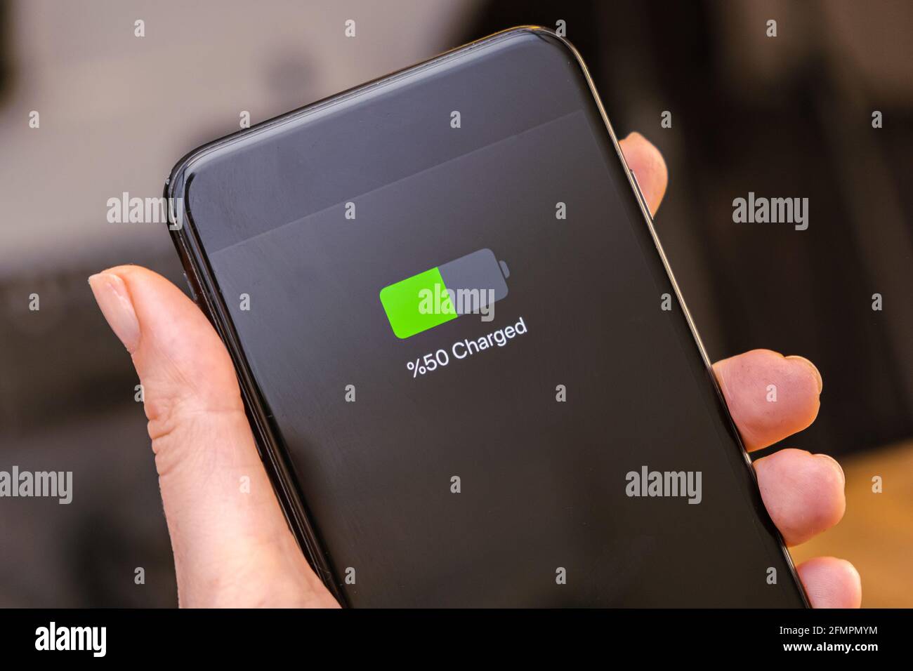 smartphone screen battery charging showing half charged battery in ...