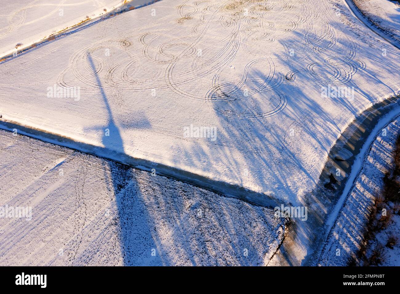 shade from mill and trees in the snow Stock Photo - Alamy