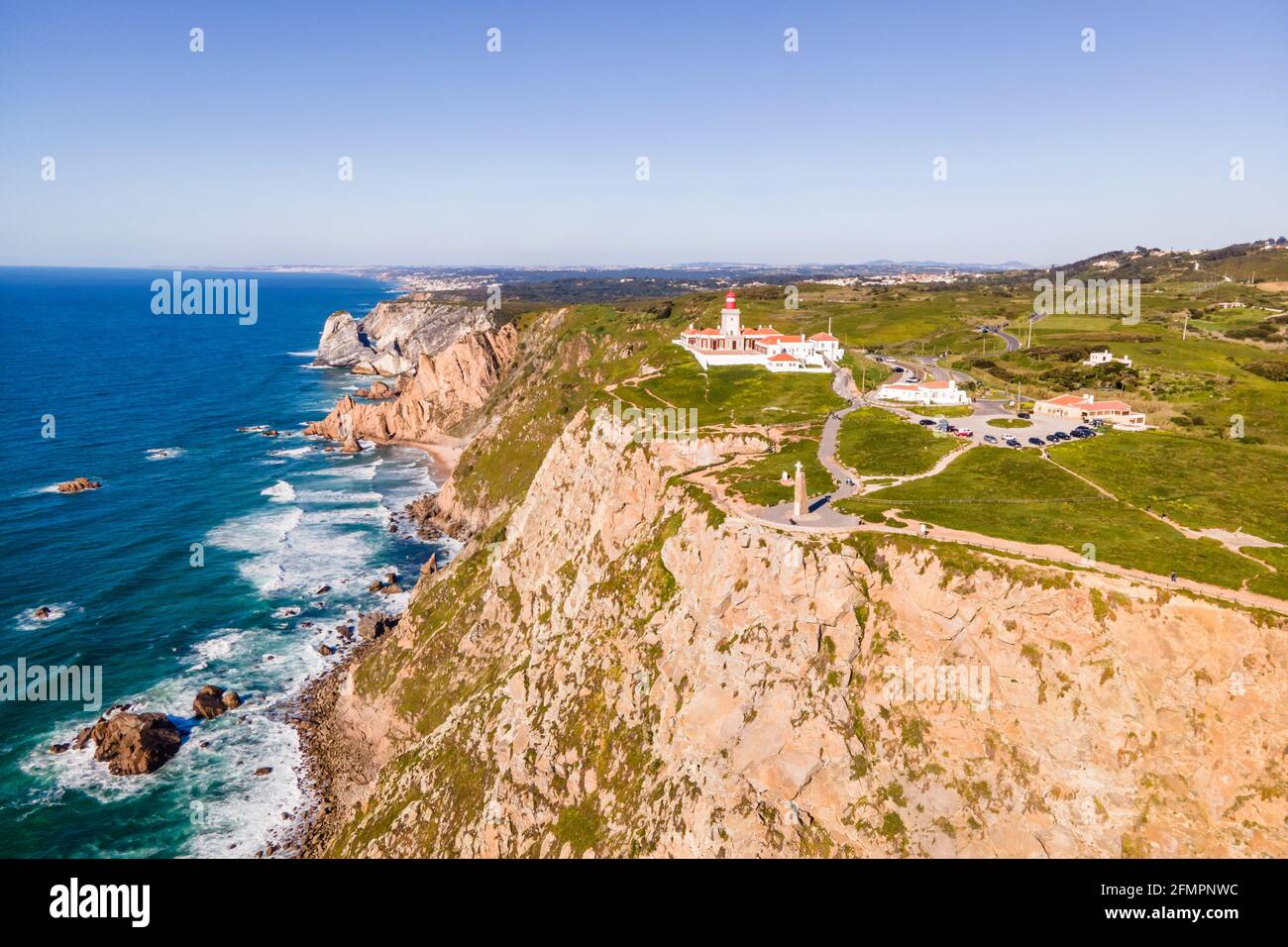 Aerial view of Cabo da Roca lighthouse with majestic coastline looking ...