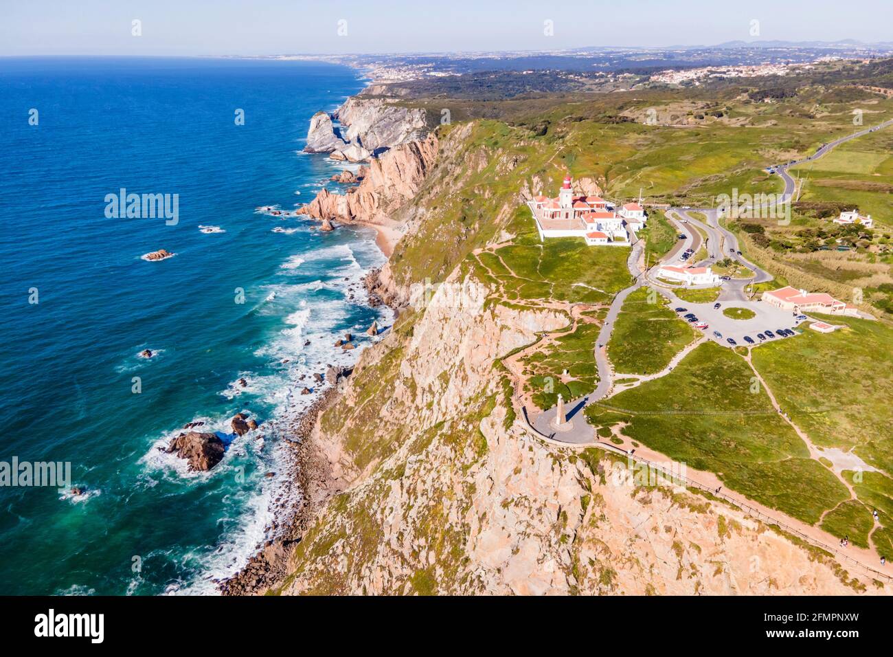 Aerial view of Cabo da Roca lighthouse with majestic coastline looking ...