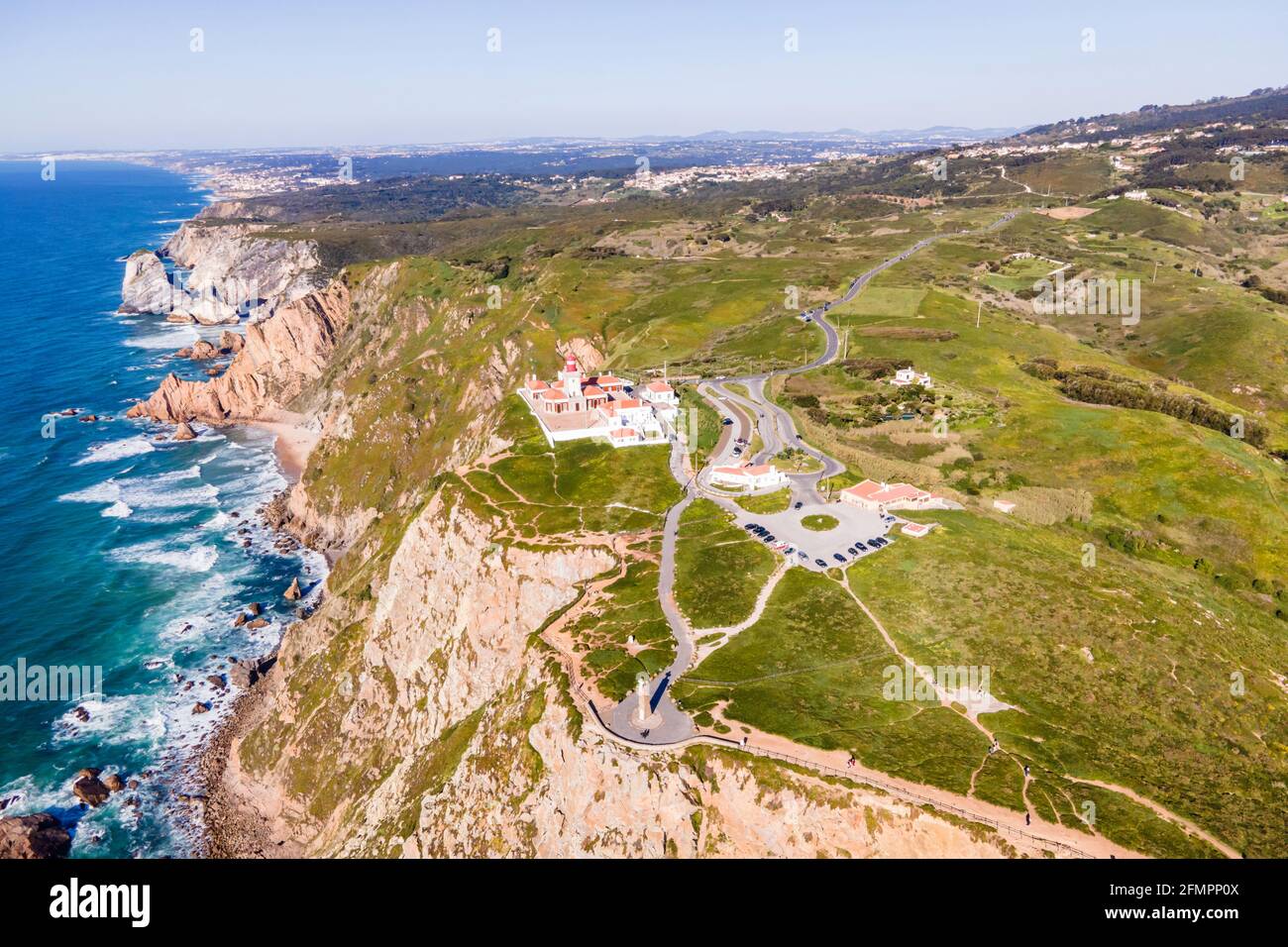 Aerial view of Cabo da Roca lighthouse with majestic coastline looking ...