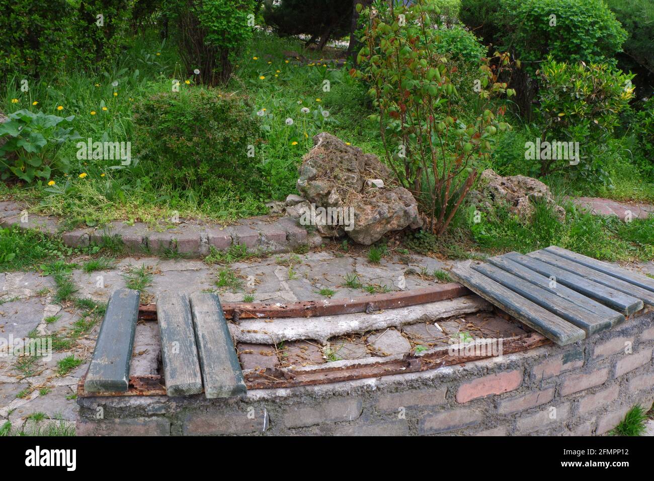 Old Ragged Bench made of bricks with missed wooden parts Stock Photo ...