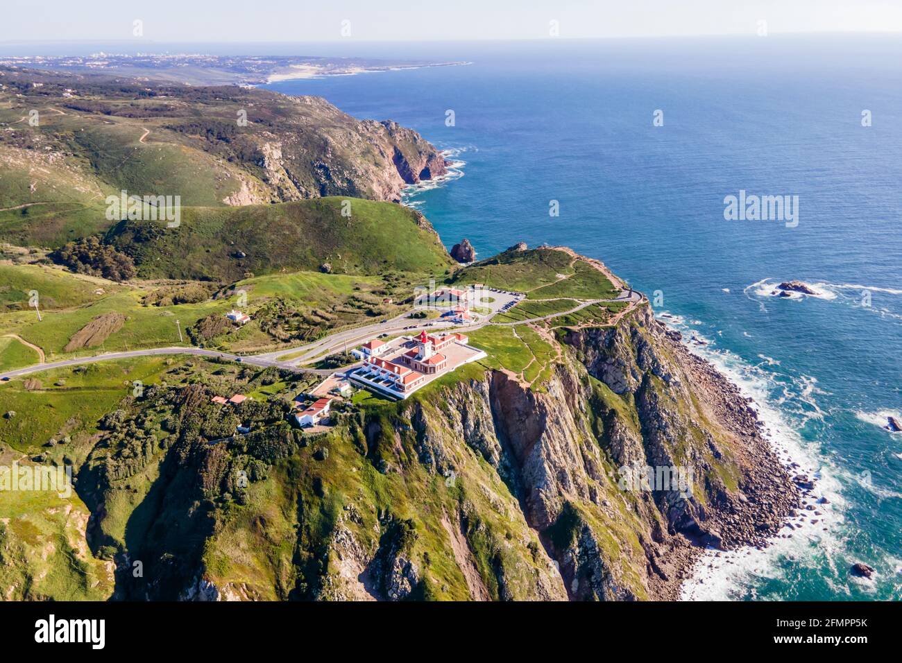Aerial view of Cabo da Roca lighthouse with majestic coastline looking ...