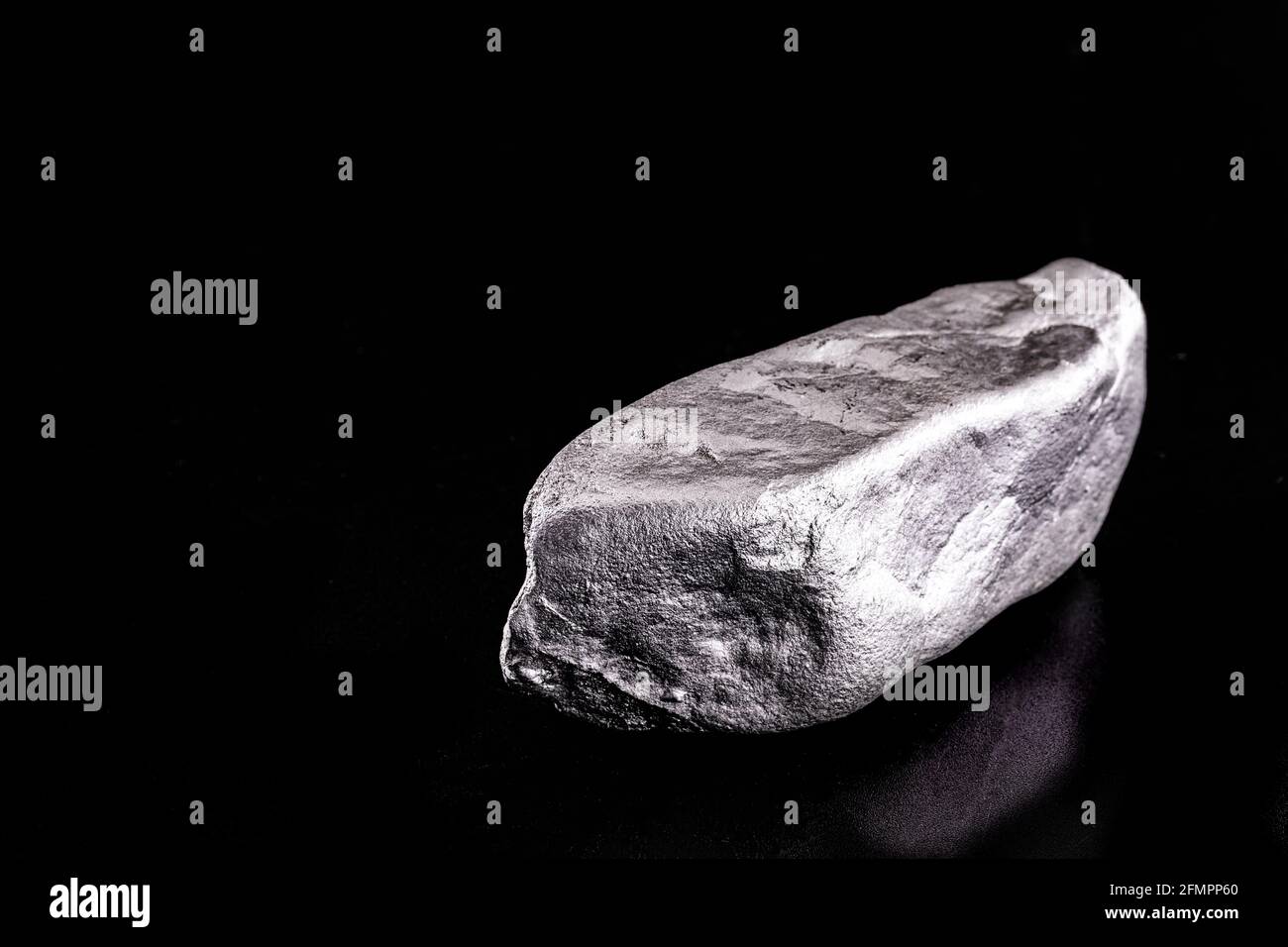 large silver stone, rare silver nugget on black background Stock Photo ...