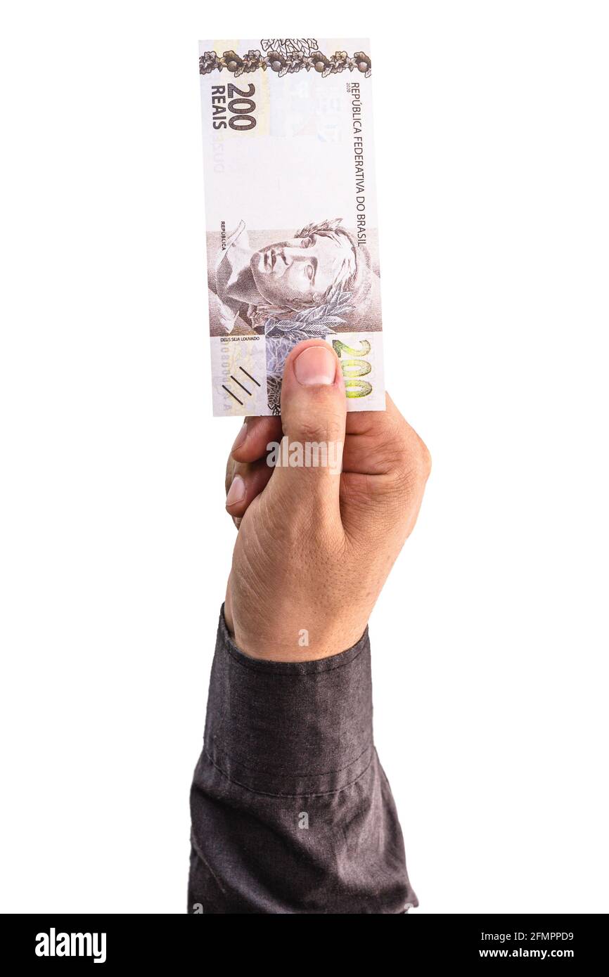 hand holding 200 reais bills, Brazilian money Stock Photo - Alamy