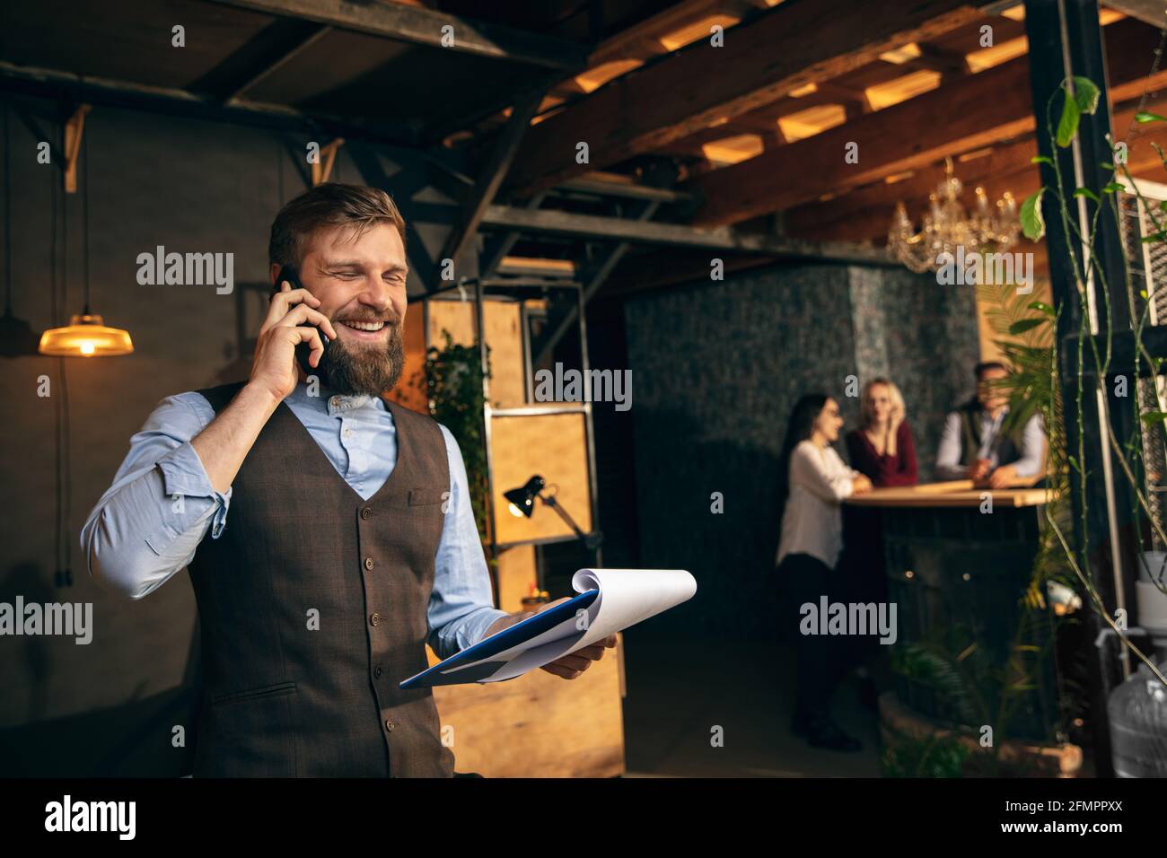 Man working in modern office using devices and gadgets during creative ...