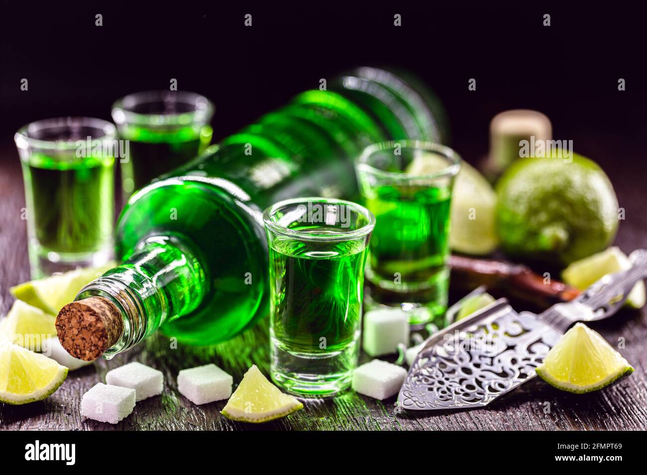 doses of absinthe with brown sugar cubes. distillate of absinthe in a ...