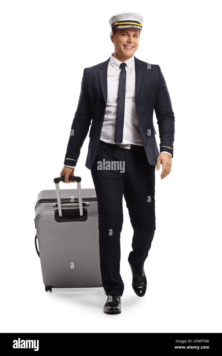 Full length portrait of a young pilot walking towards camera and ...