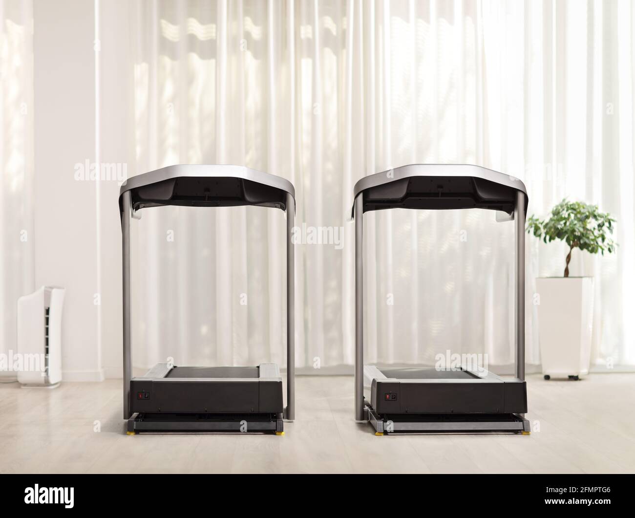 Two treadmills in a luxury athlete center Stock Photo - Alamy