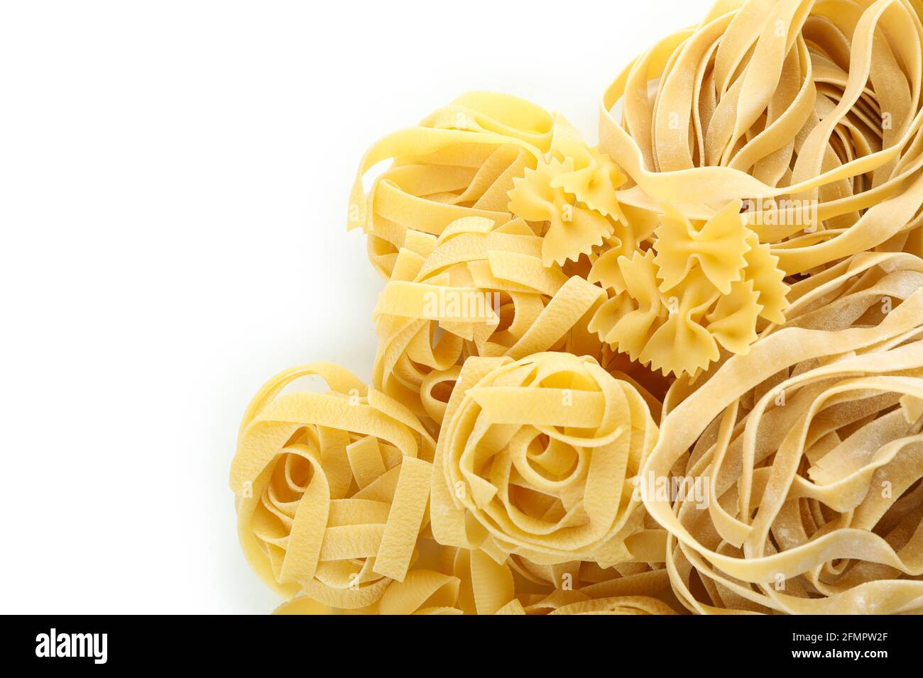 Uncooked raw pasta isolated on white background Stock Photo - Alamy