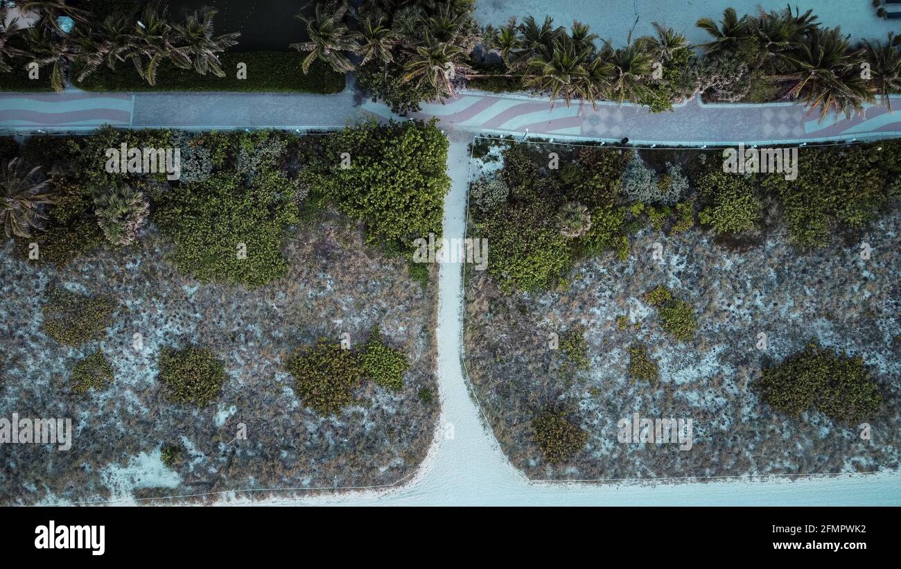 Top view shot of directly above sand path to beach and boardwalk in ...
