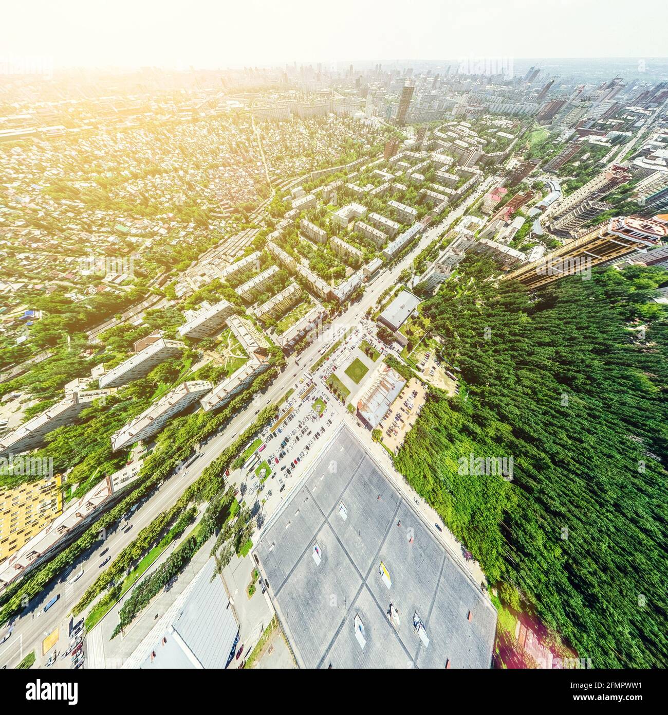 Aerial city view with crossroads and roads, houses, buildings, parks ...