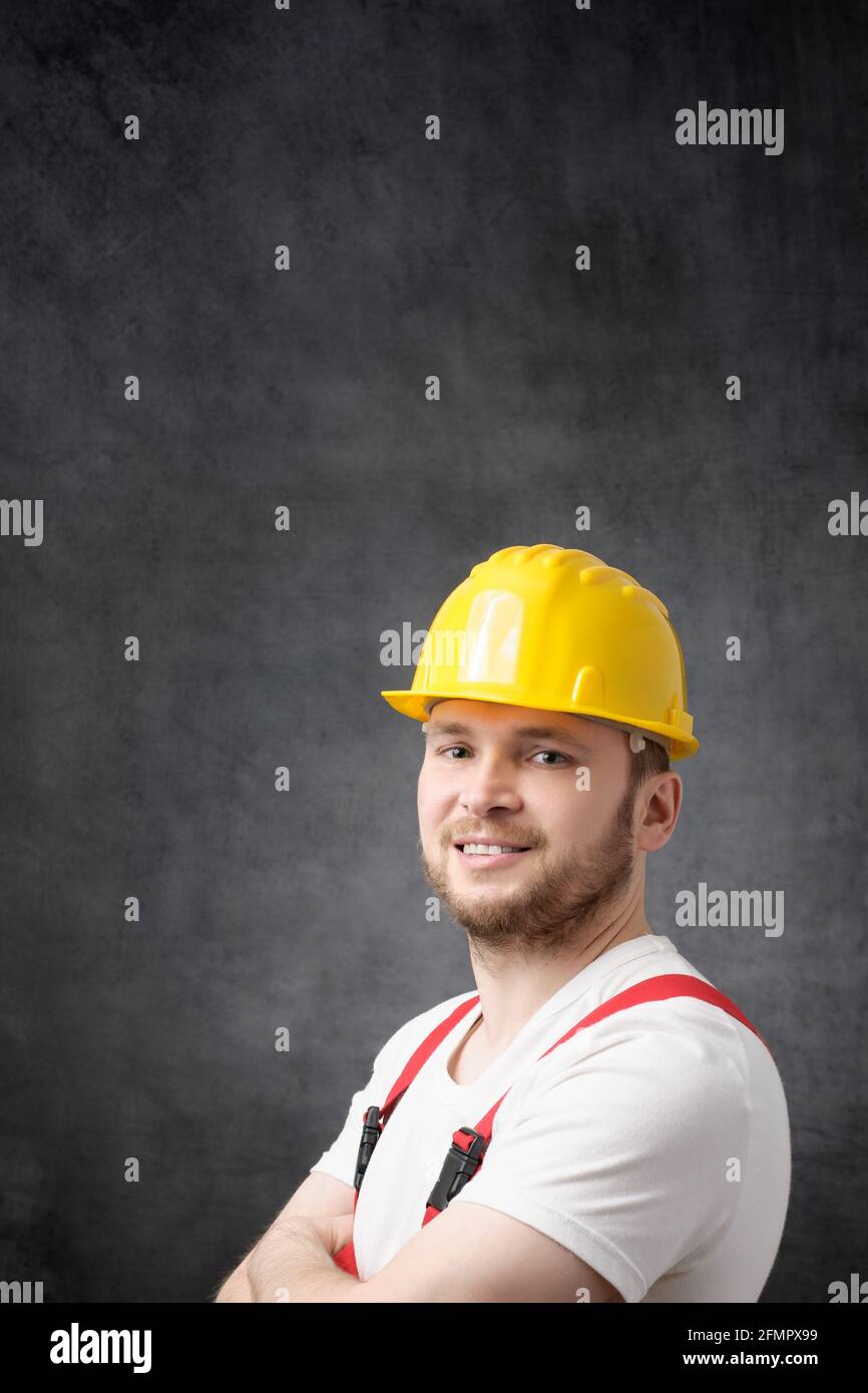 Happy, smiling worker with arms crossed looking at camera Stock Photo ...