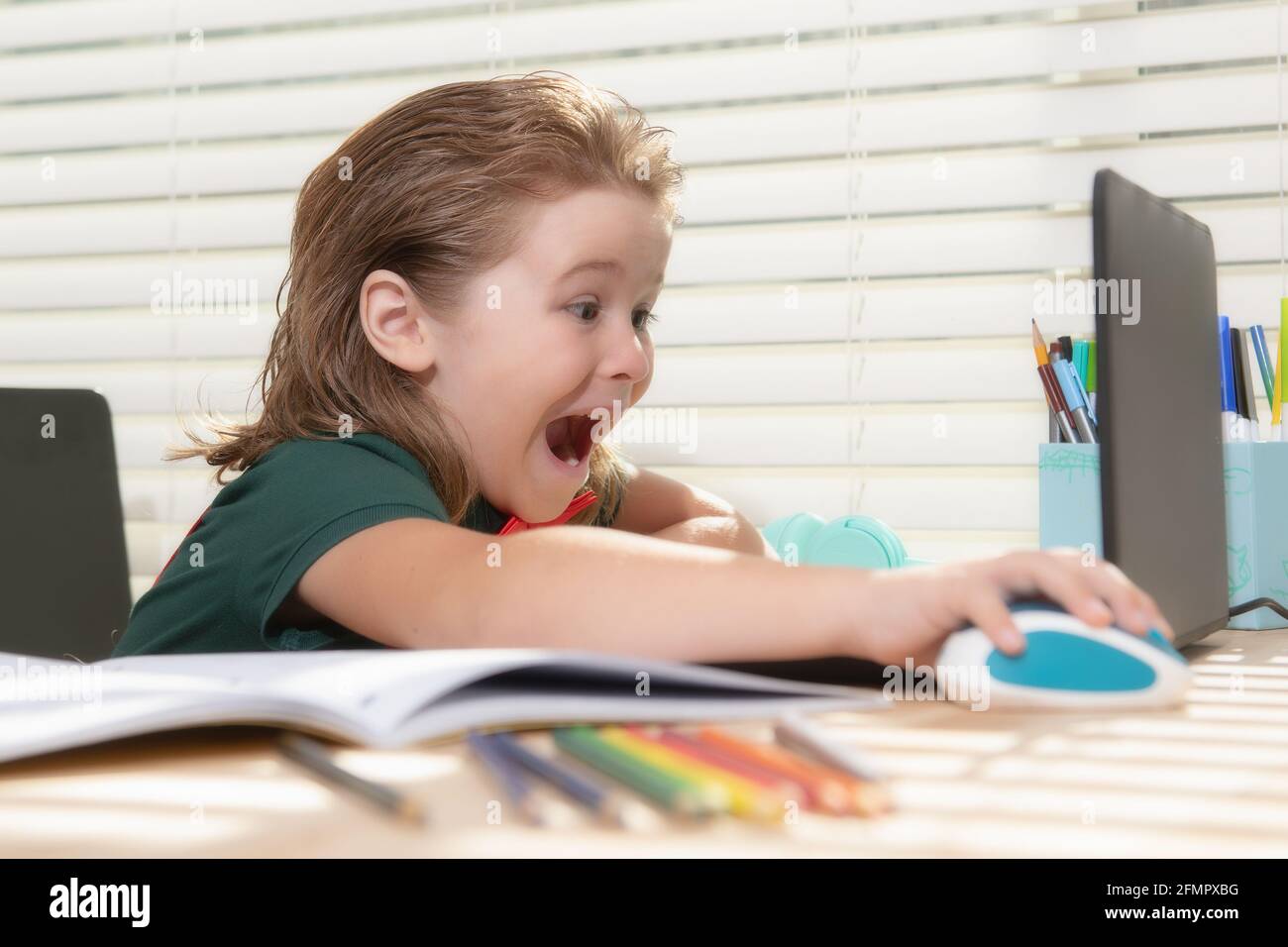 Schoolboy pupil kid studying online using laptop. Child attending ...