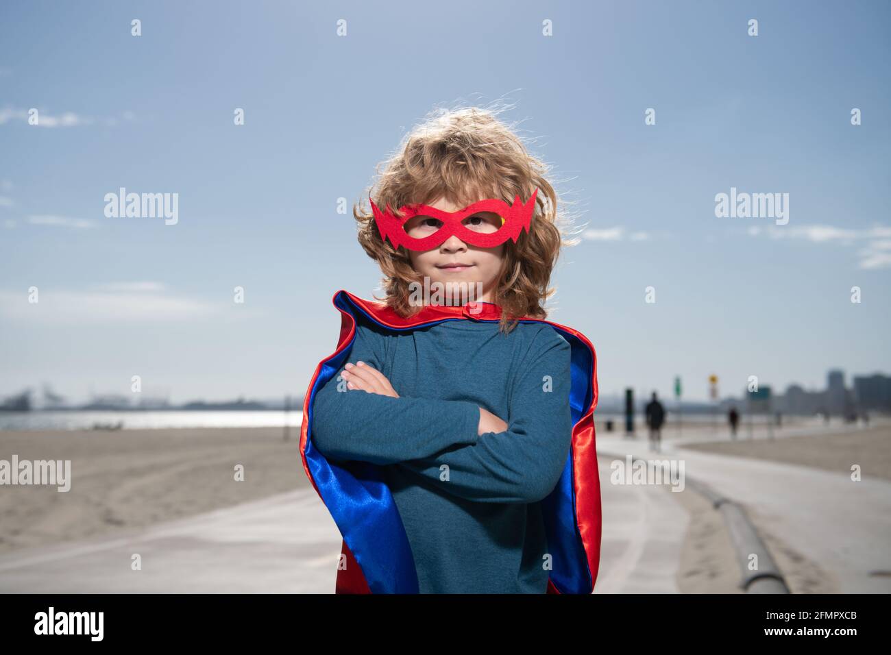 Portrait of child wearing a superhero costume. Super hero child against ...