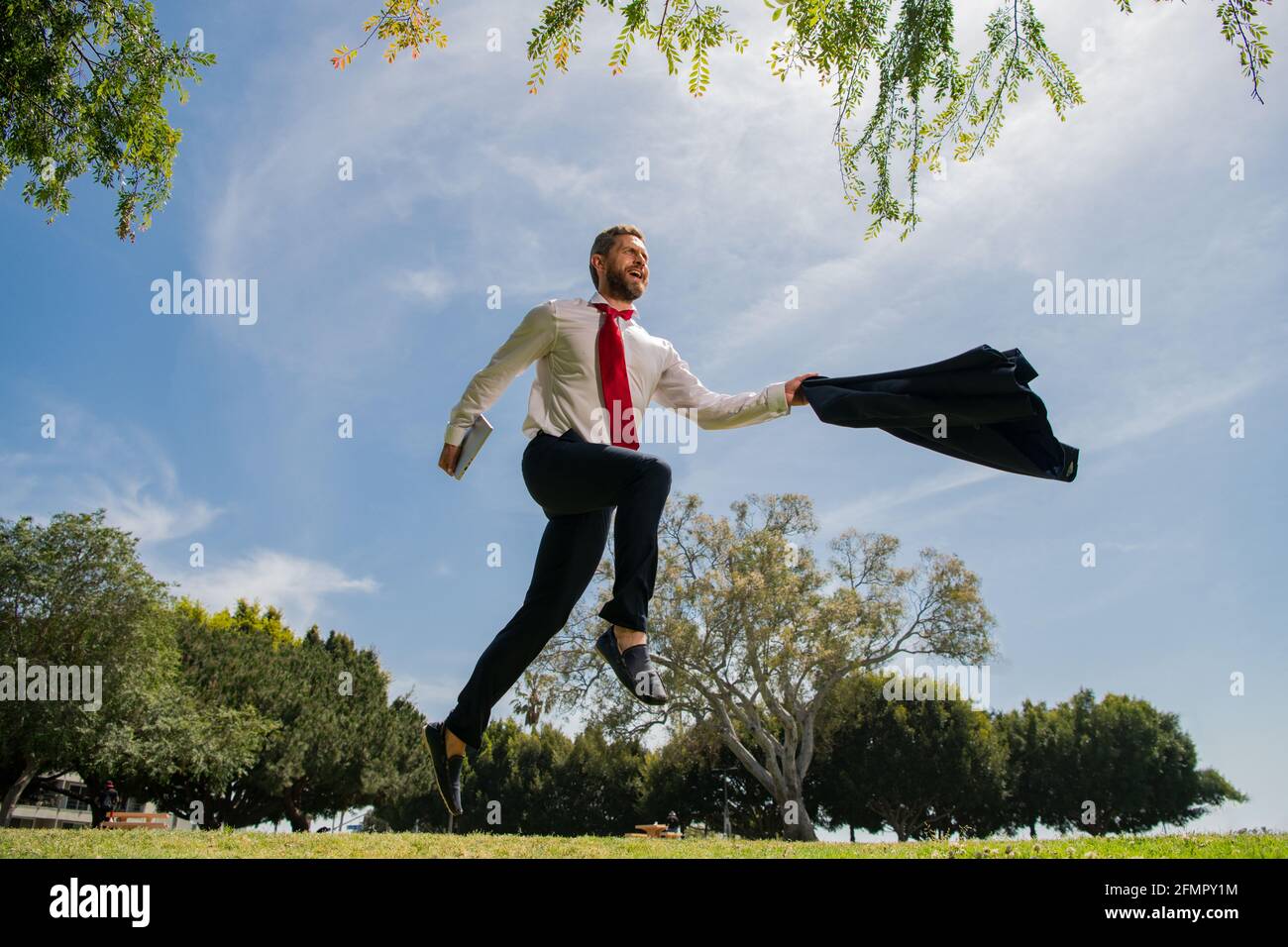 Excited businessman running fast, racing and jumping Stock Photo - Alamy