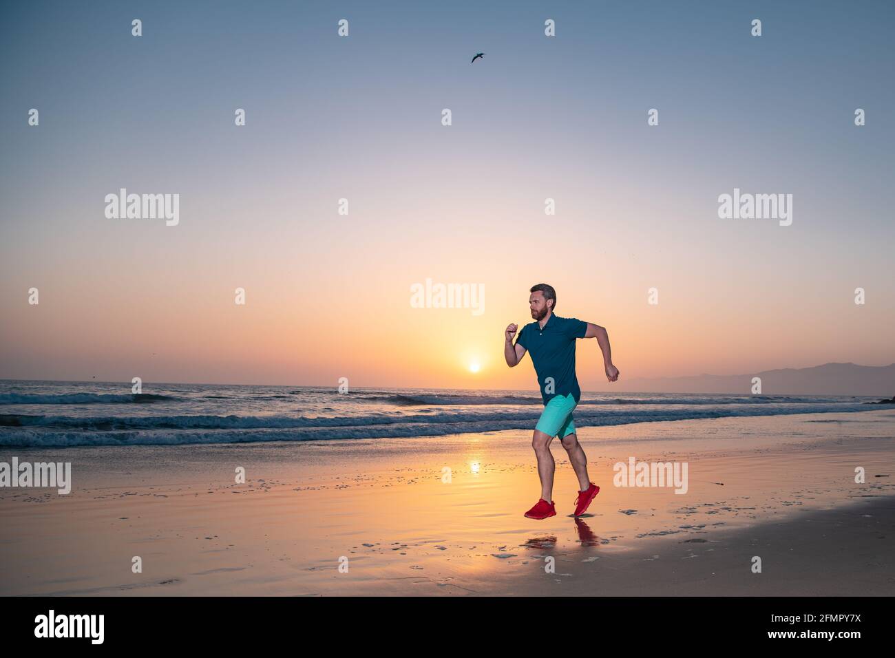 Runner man on the beach be running for exercise. Active healthy runner ...