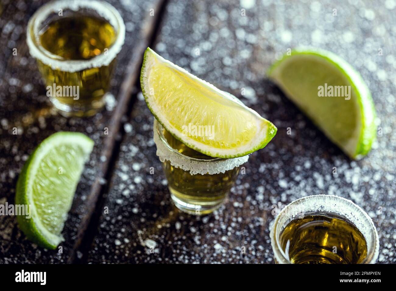 glass of tequila, made of distilled alcohol, lemon, salt and blue agave ...