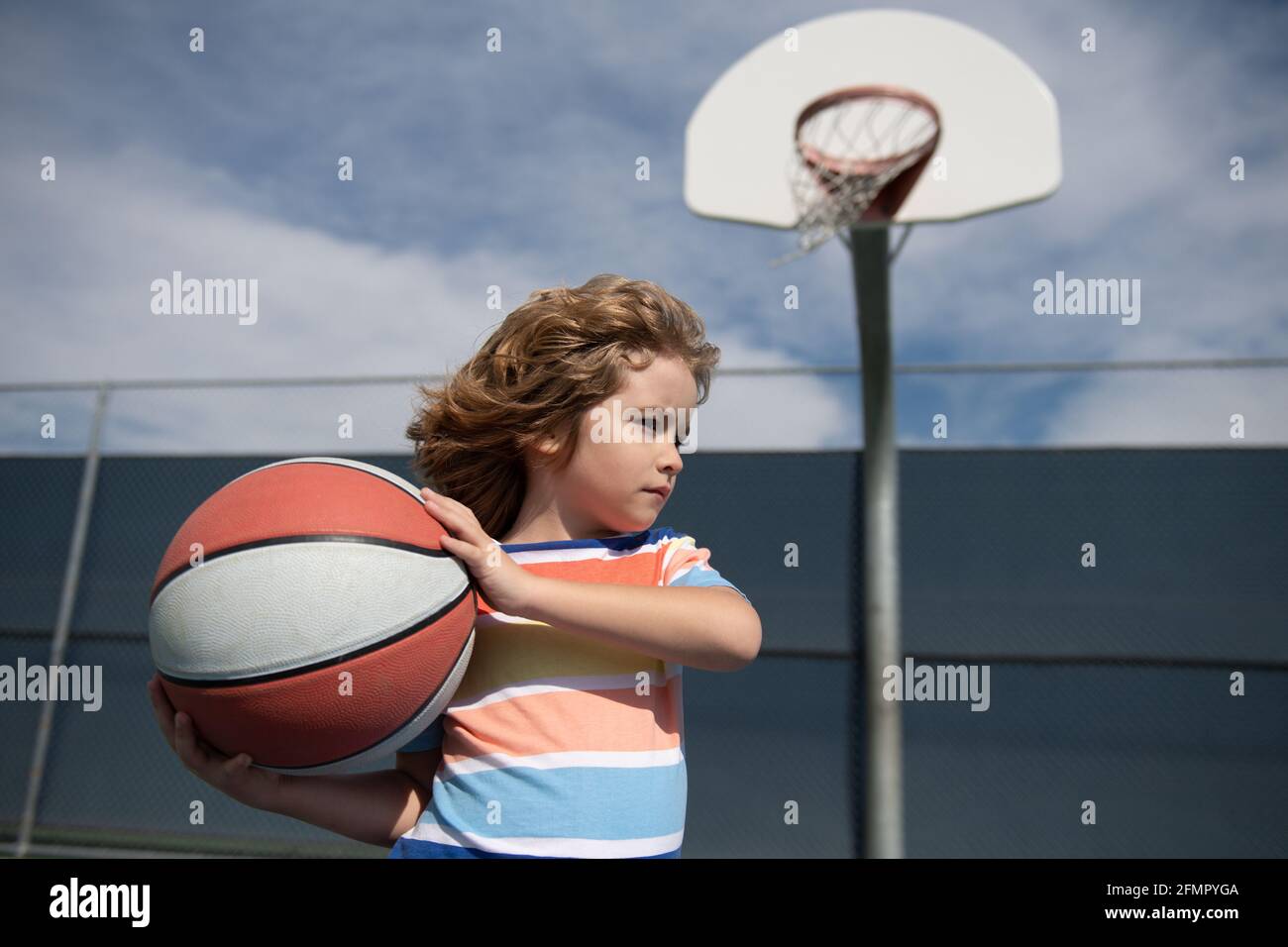 Cute child playing basketball. Basketball kids training game. Active ...
