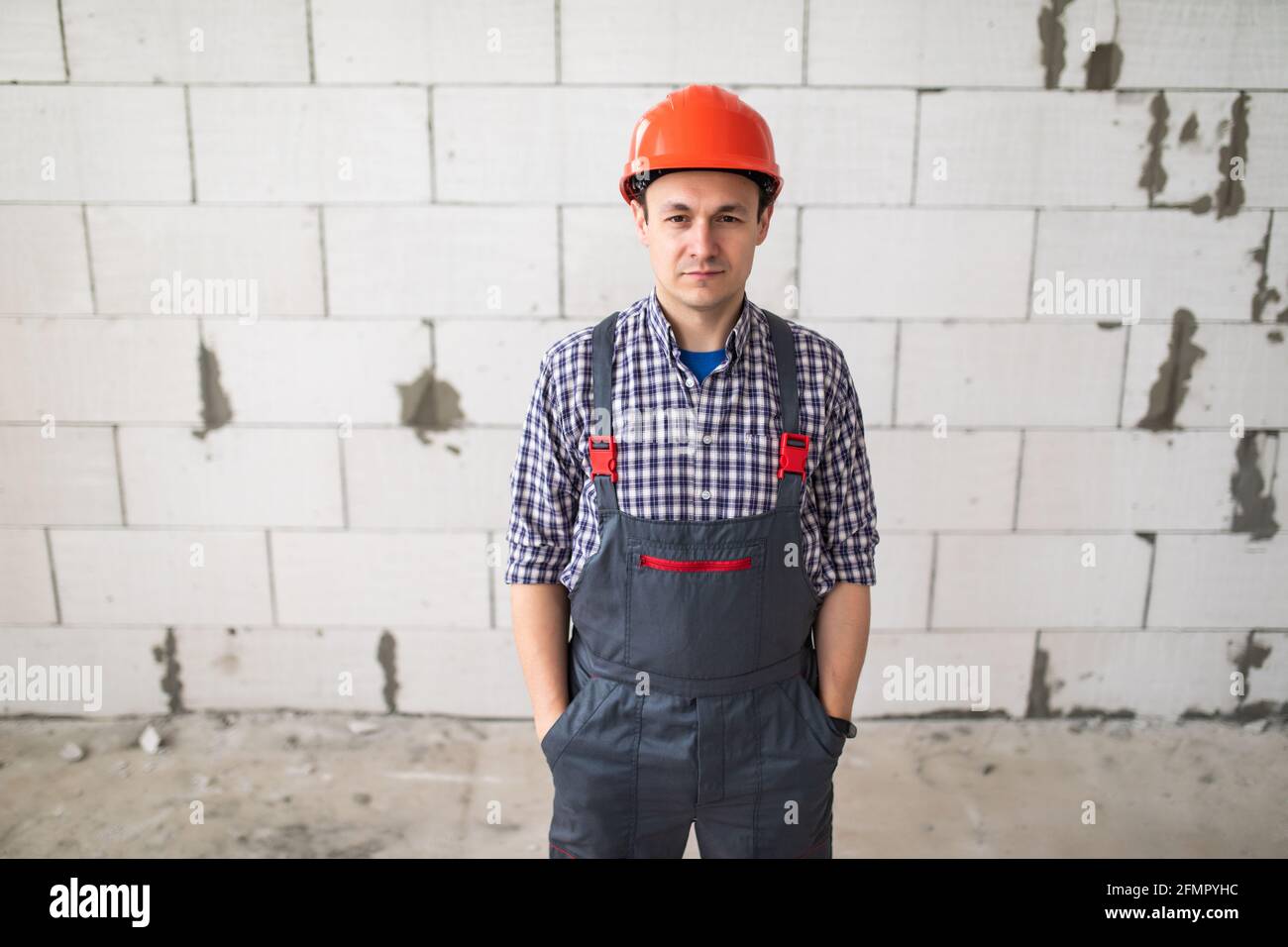Building inspector young man Looking At New Property Stock Photo - Alamy