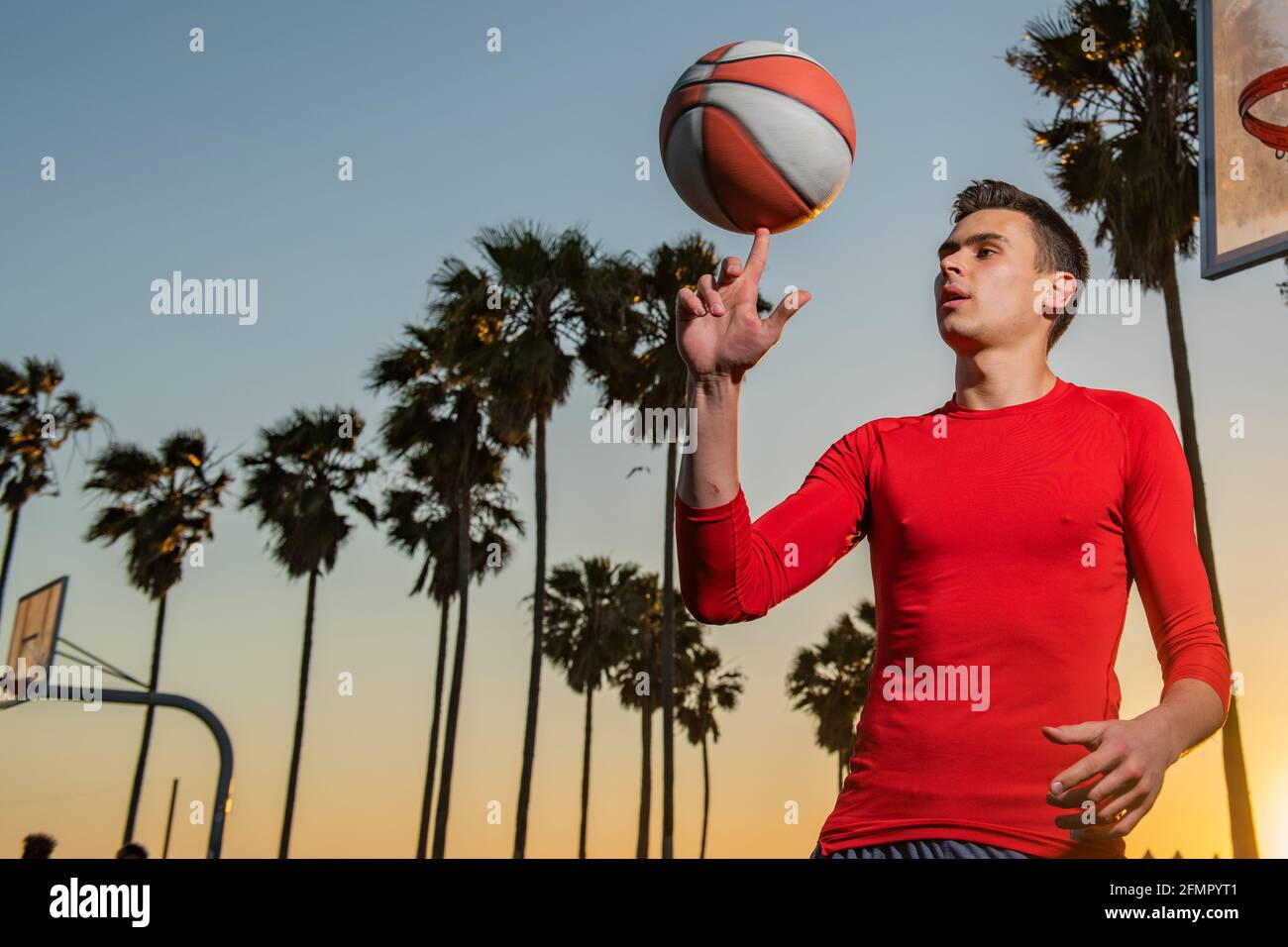 Basketball player. Hand spinning basket ball. Balancing basketball on ...