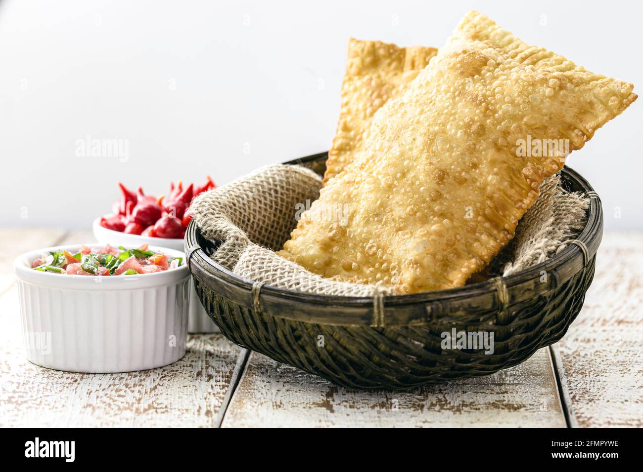 Fried pastry with potato, hot sauce served hot Stock Photo - Alamy