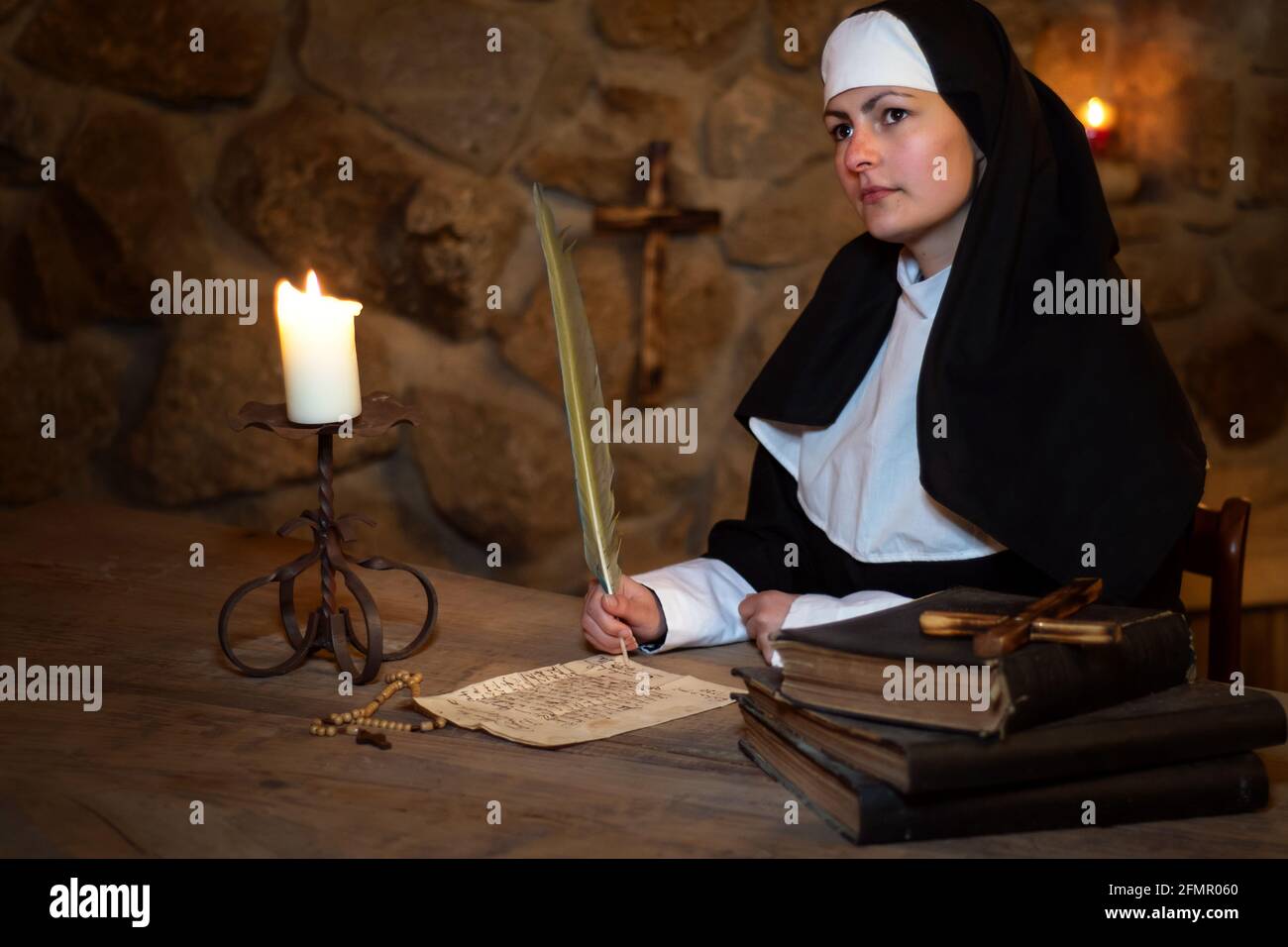 Young medieval nun writes a letter Stock Photo - Alamy