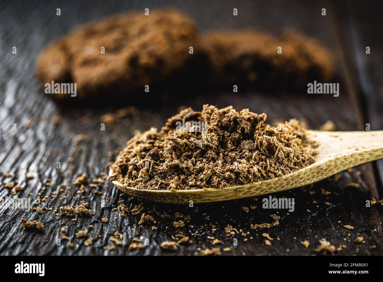 spoon with grated chocolate, chocolate powder used as cookies ...