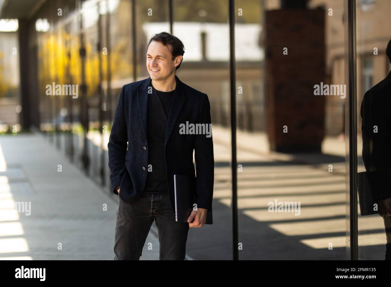 Professional man walking laptop computer hi-res stock photography and ...