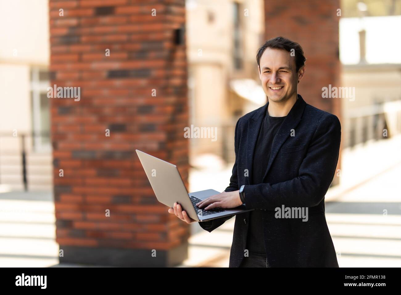 Professional man walking laptop computer hi-res stock photography and ...