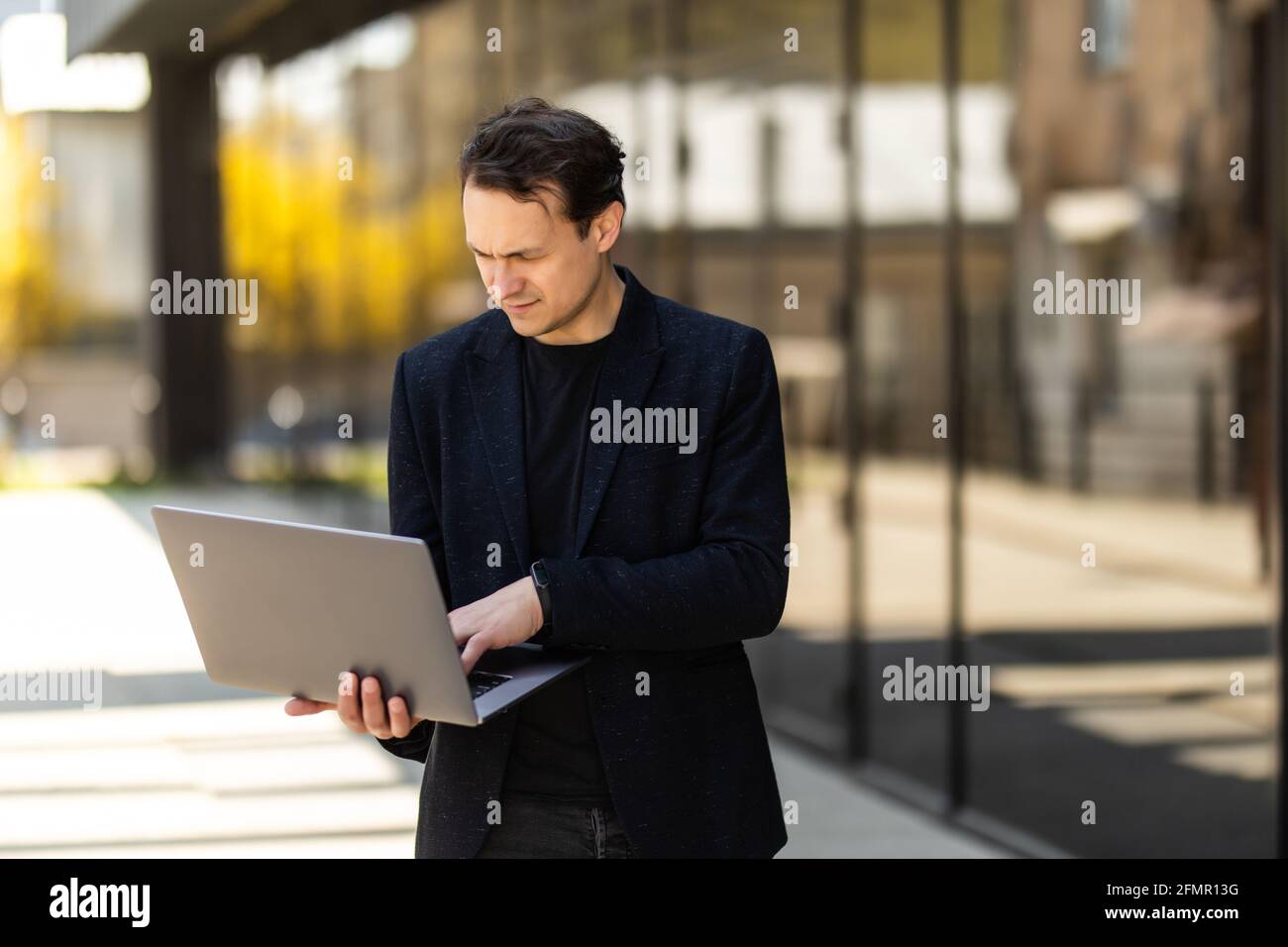Professional man walking laptop computer hi-res stock photography and ...