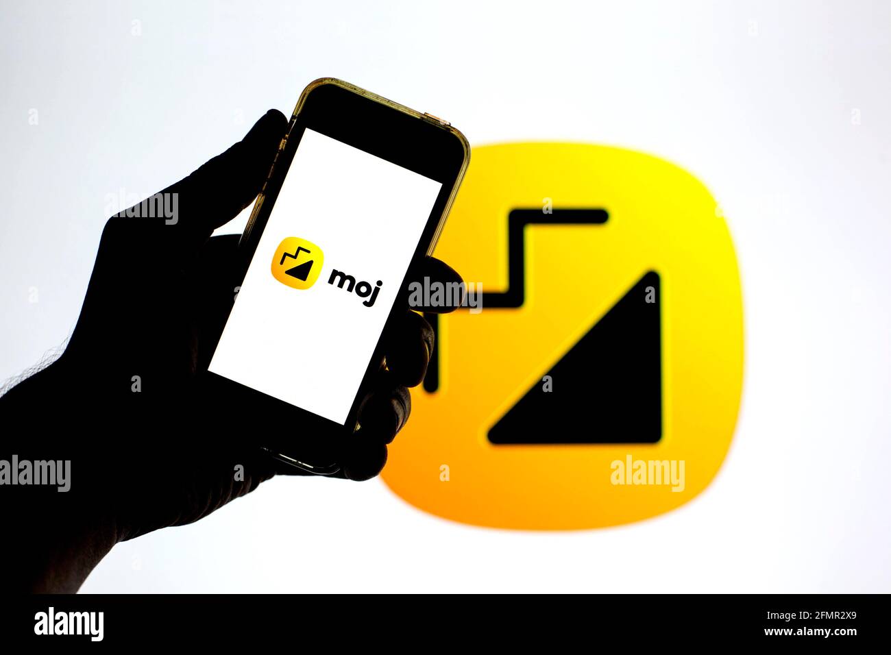 In this photo illustration a Moj app seen displayed on a smartphone ...
