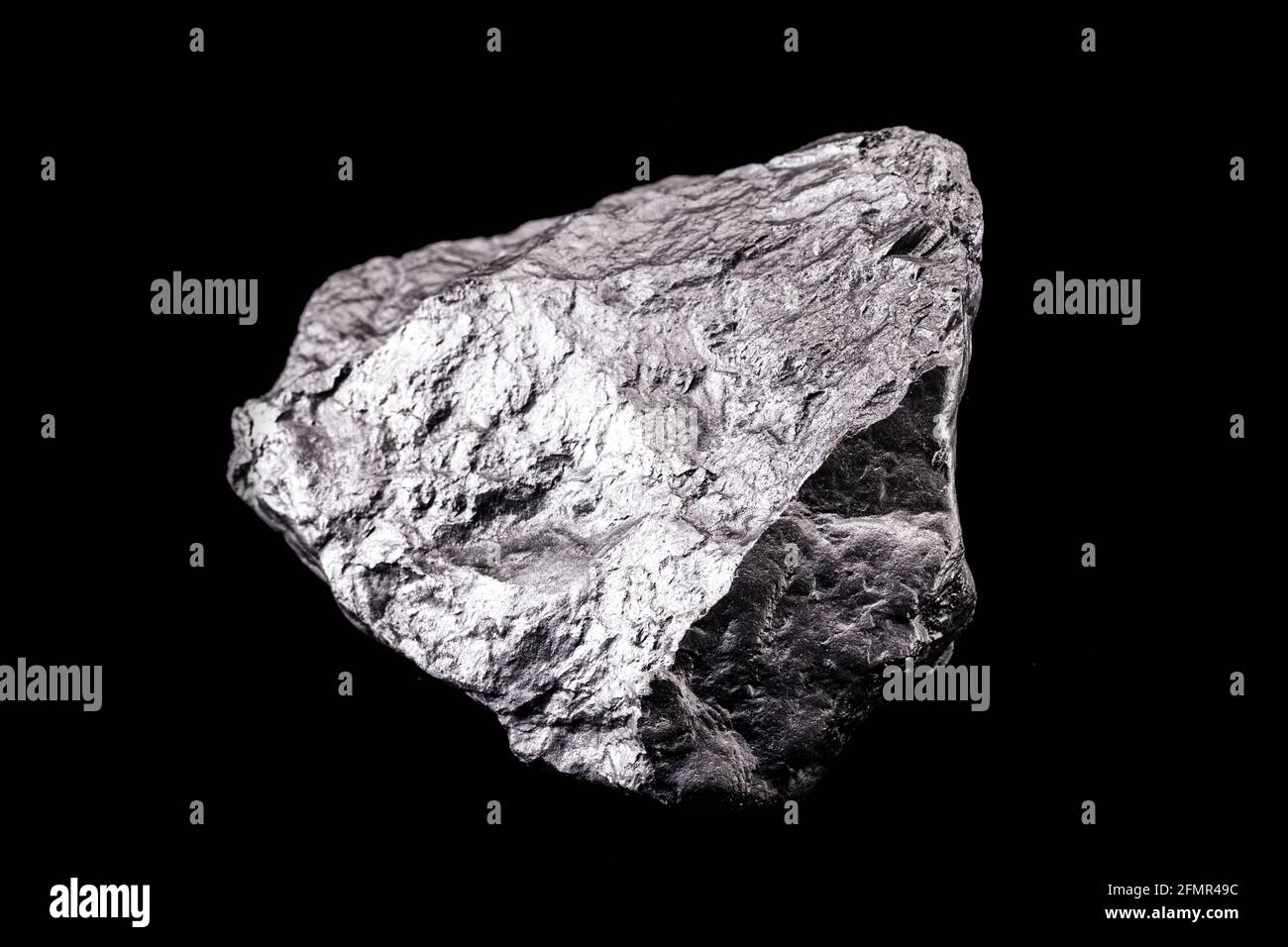 Raw manganese. Manganese stone isolated on black background. Mineral ...