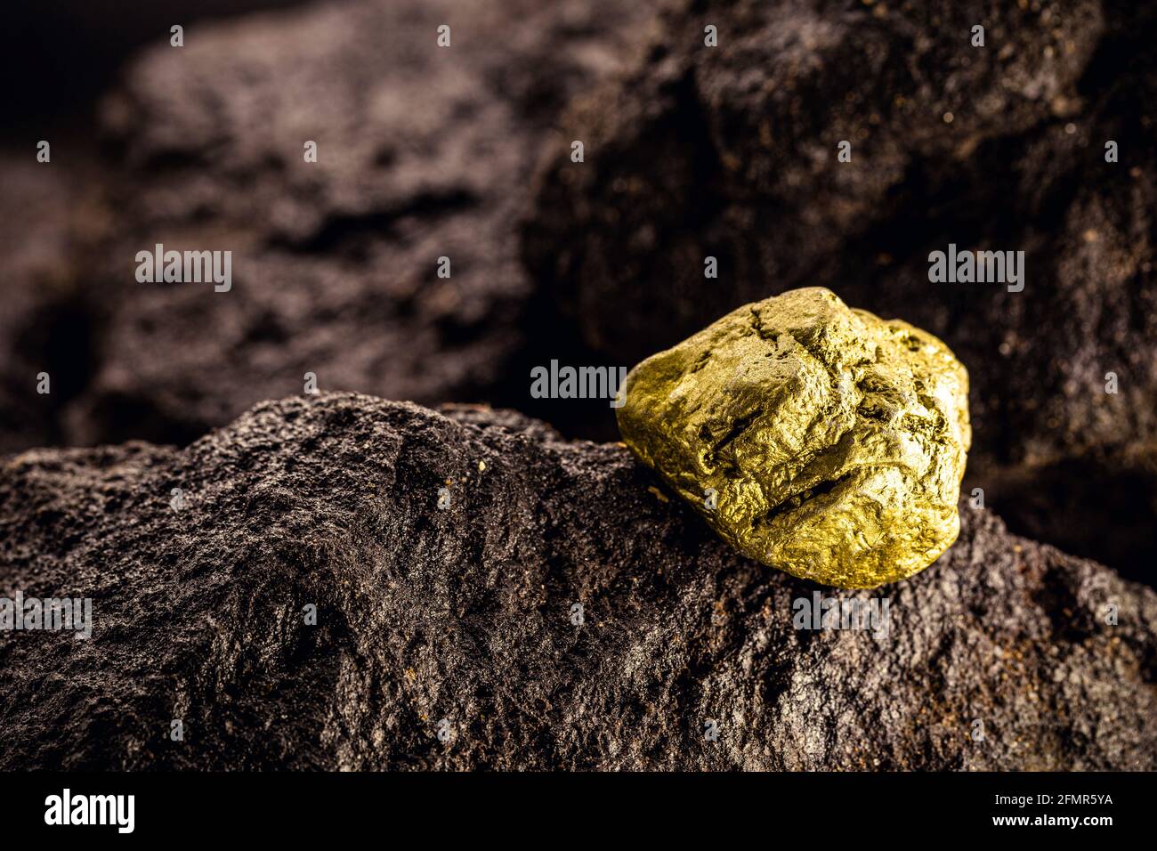 gold stone in mine, extraction of precious stones Stock Photo - Alamy