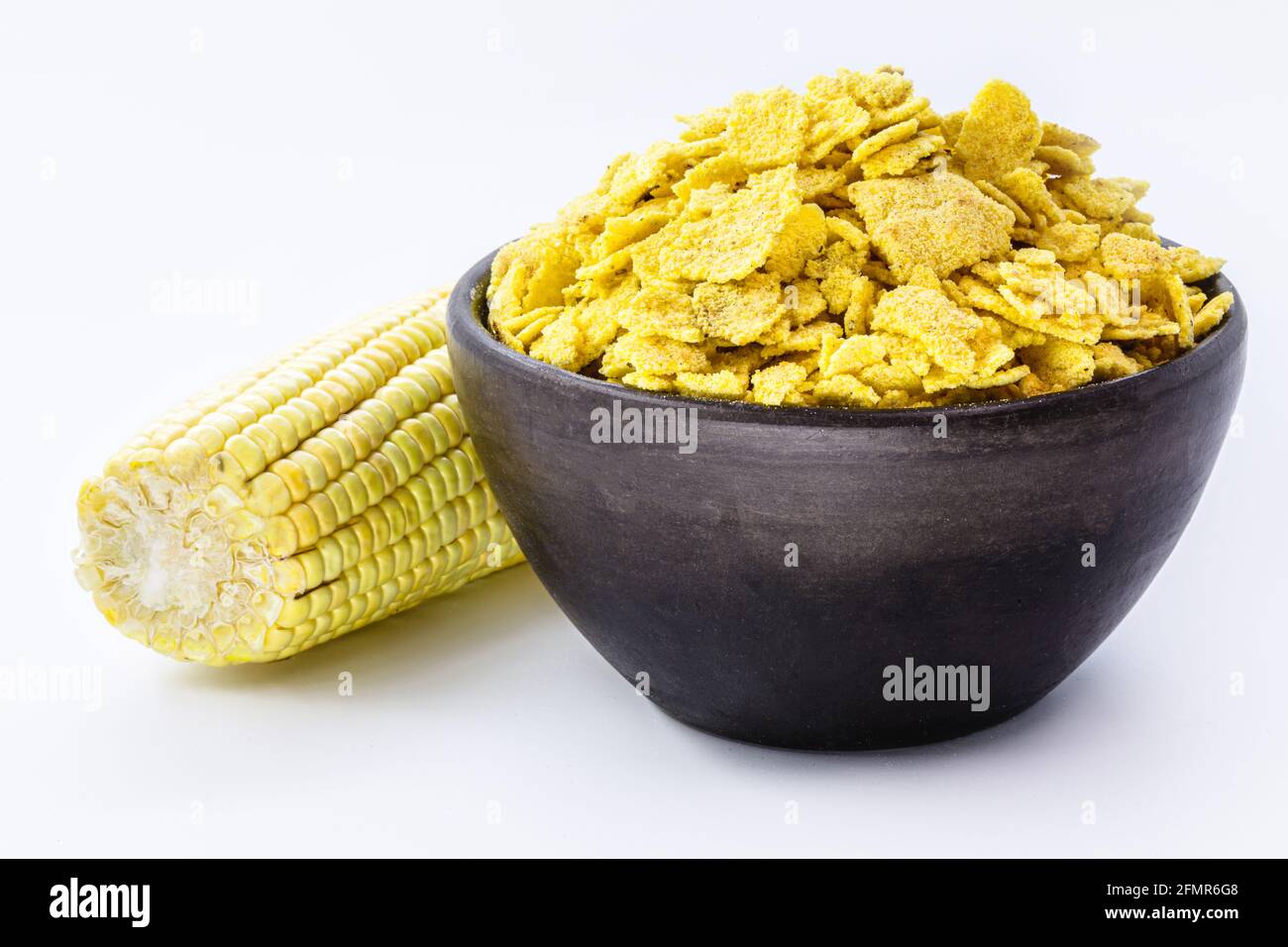 brazilian corn flour in handmade clay pot, and corn cob with isolated ...