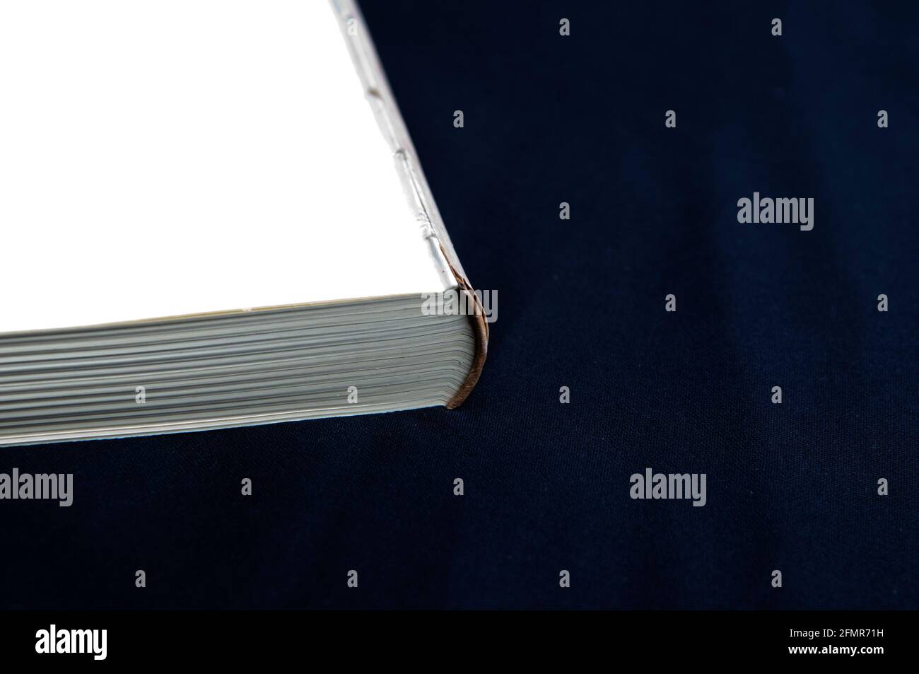 The process of book binding; preparing the book spine. Black background ...