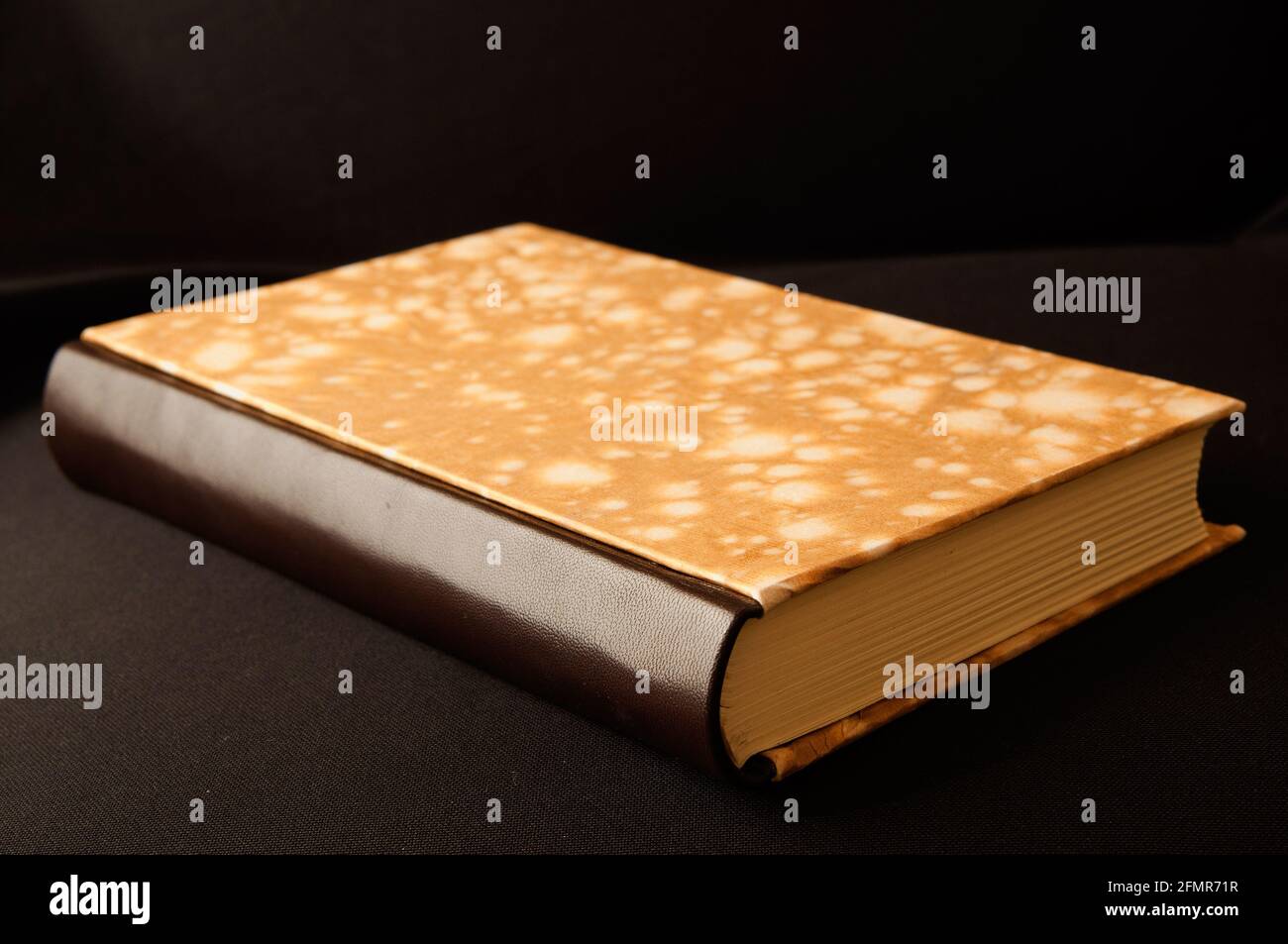 bookbinding. Beautiful handmade book with leather book spine and marble ...