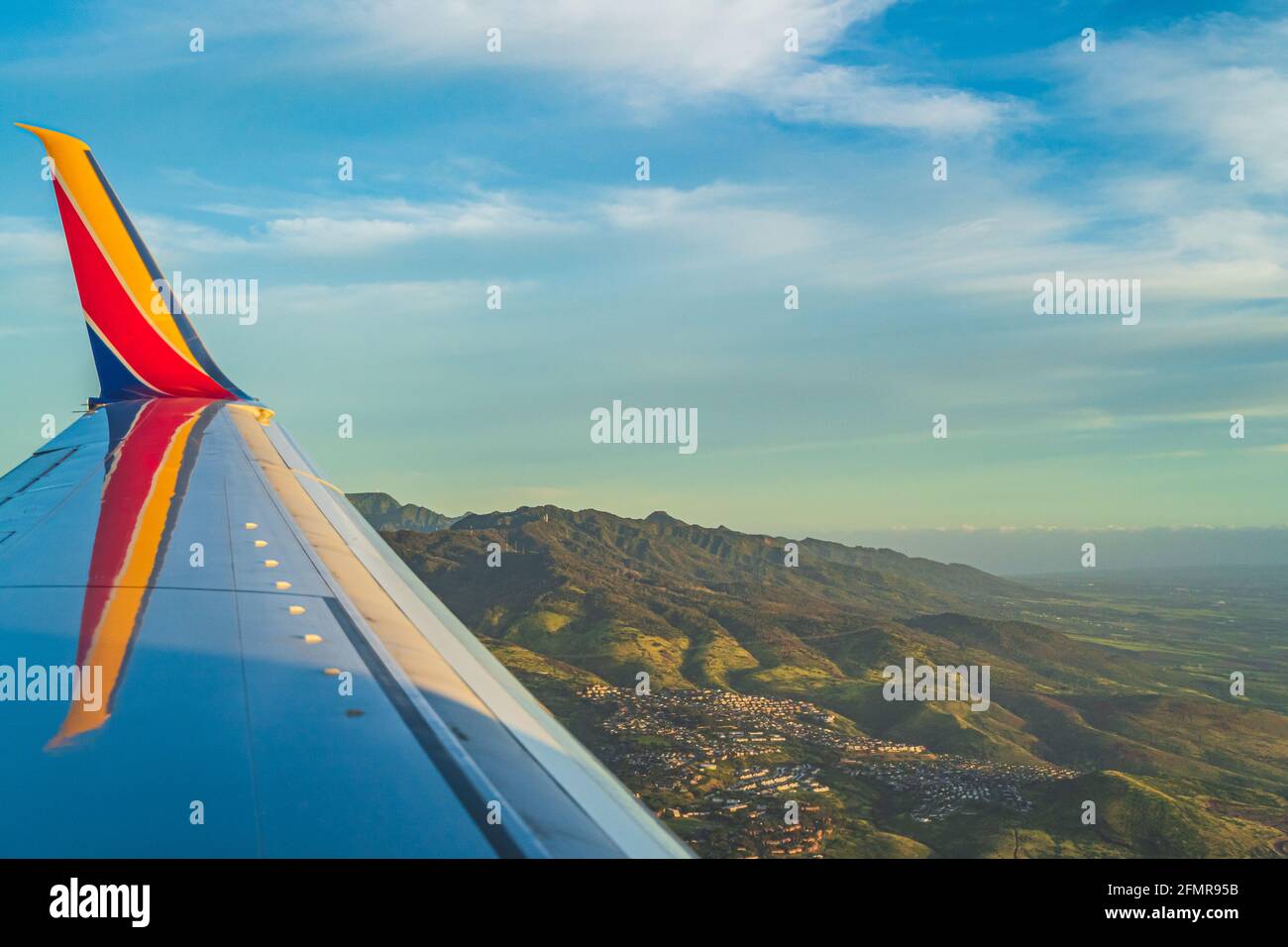 Winglet view of Southwest flight over Oahu Hawaii during sunset Stock ...