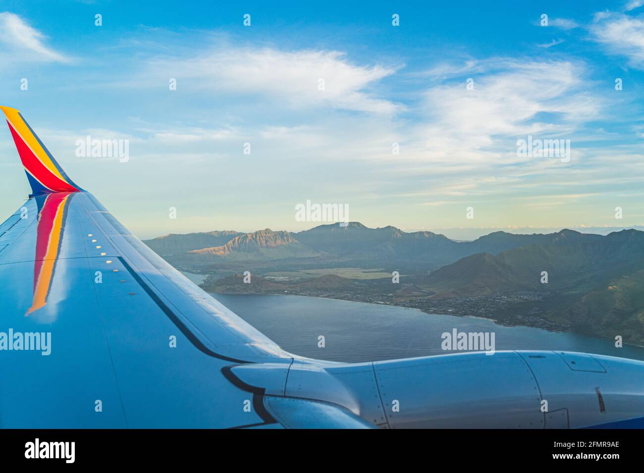 Winglet view of Southwest flight over Oahu Hawaii during sunset Stock ...