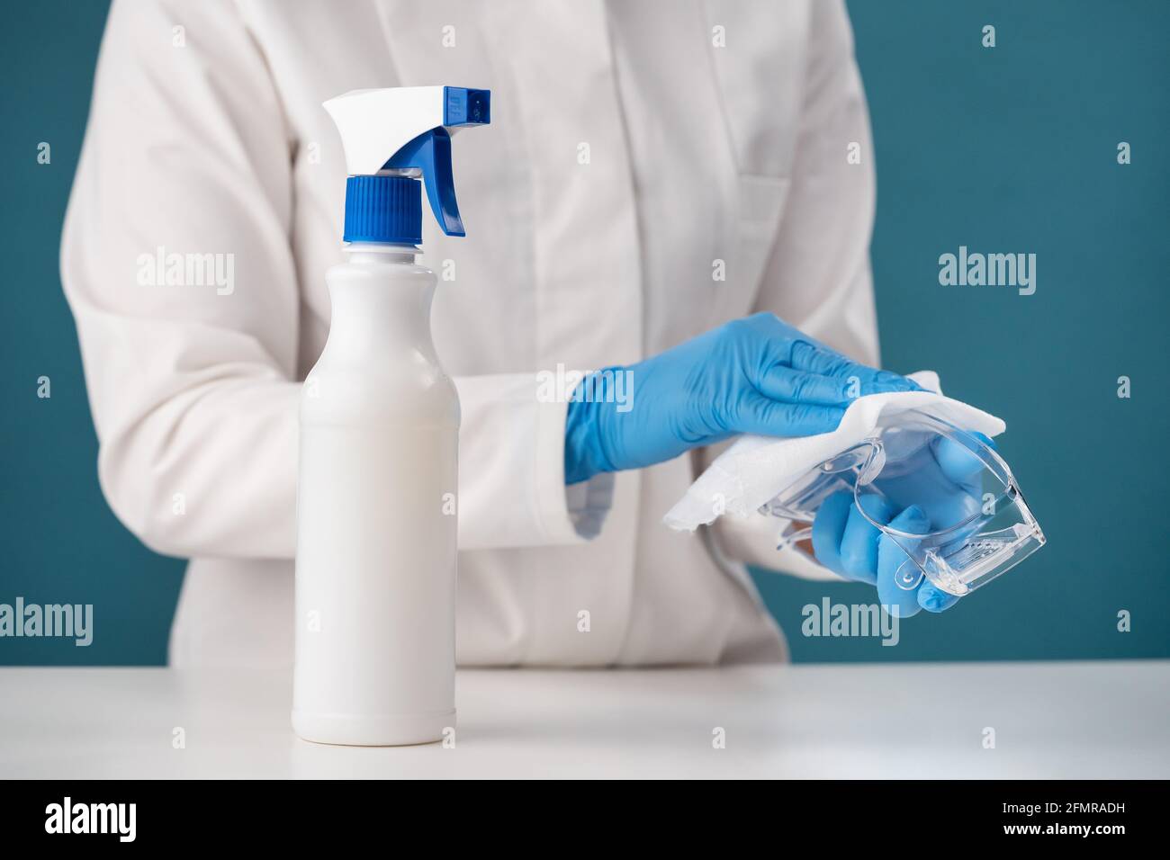 Disinfection with a solution from a spray bottle by wiping medical ...