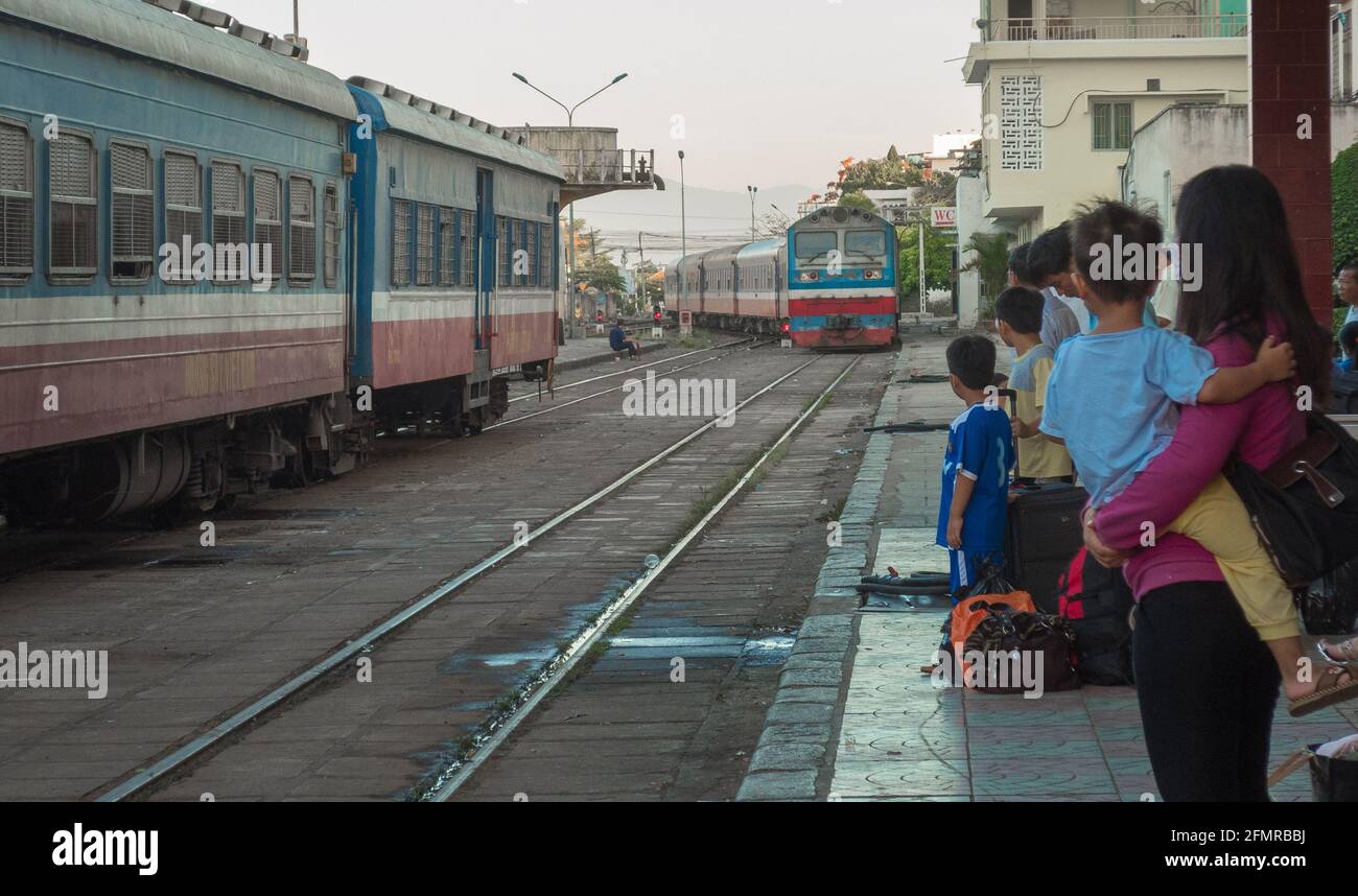 Passengers waiting at a station The Reunification Express Railway in ...