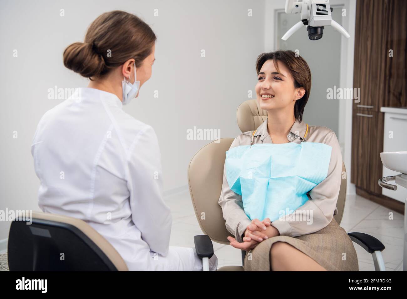 Closeup portrait of a smiling happy patient in dentistry office. Clinic ...