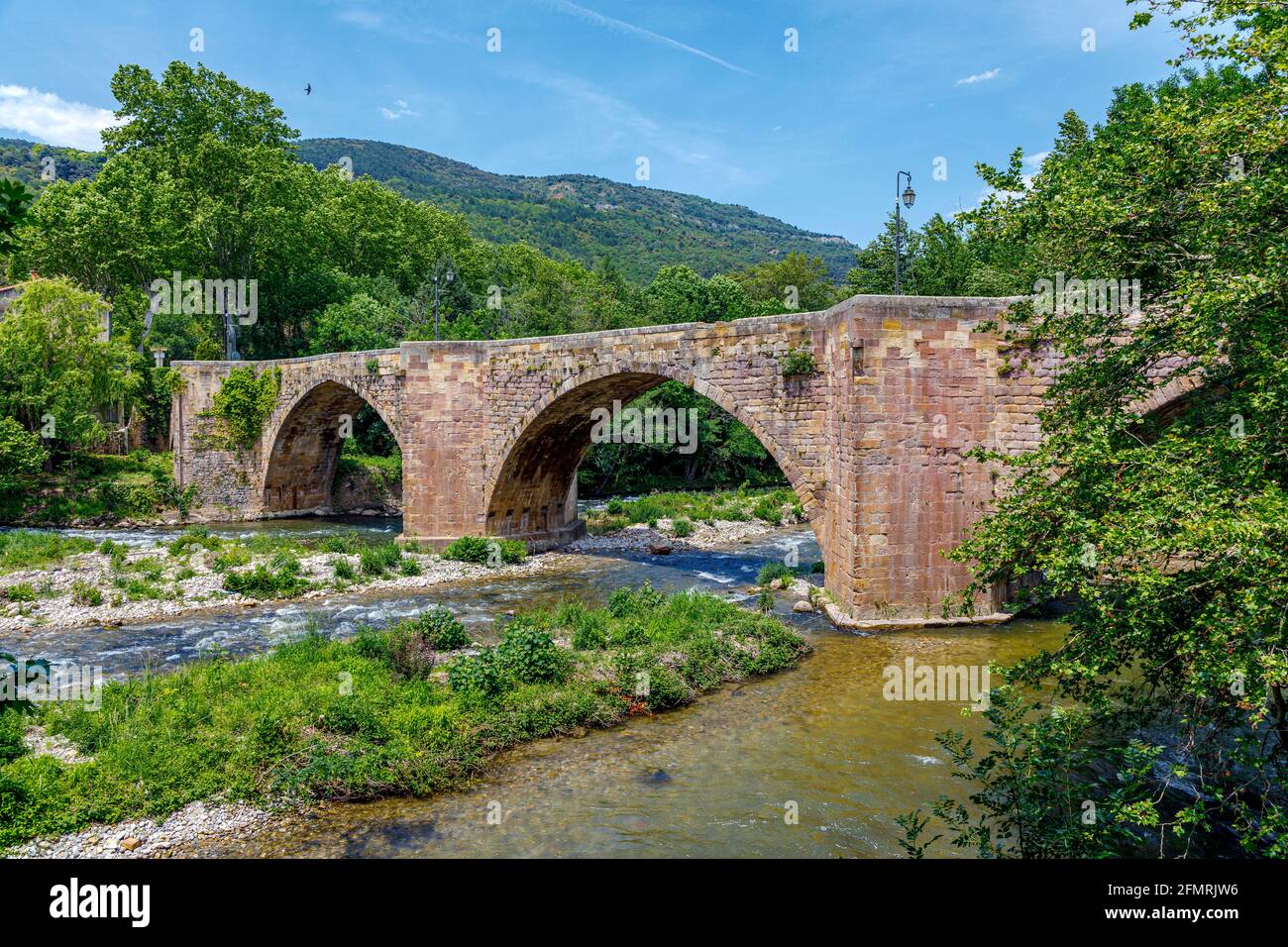 Old medieval bridge over the river Aude, in the center of Alet les ...
