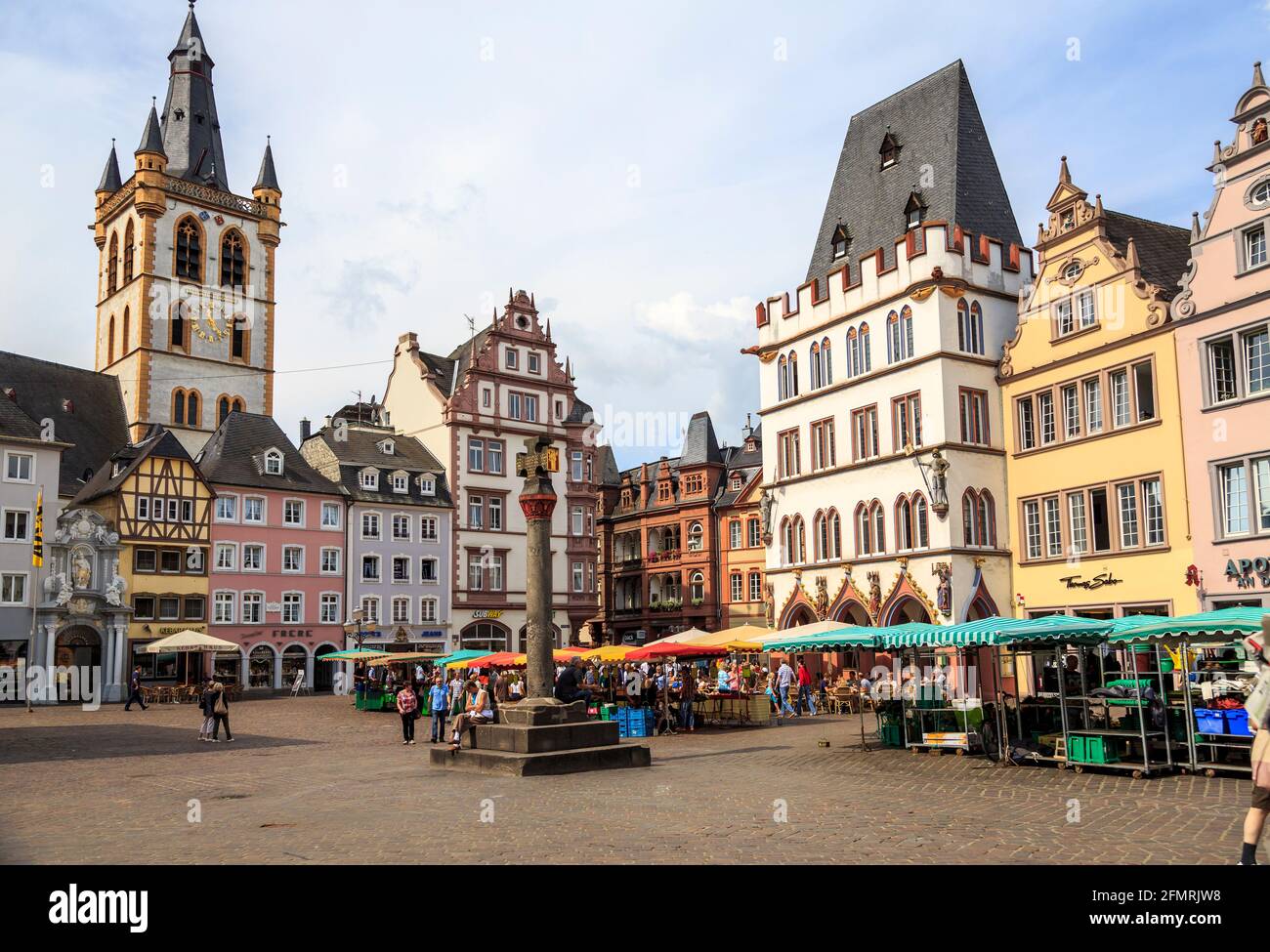 TRIER, GERMANY- AUGUST 9: People and stalls at Market square in Trier ...