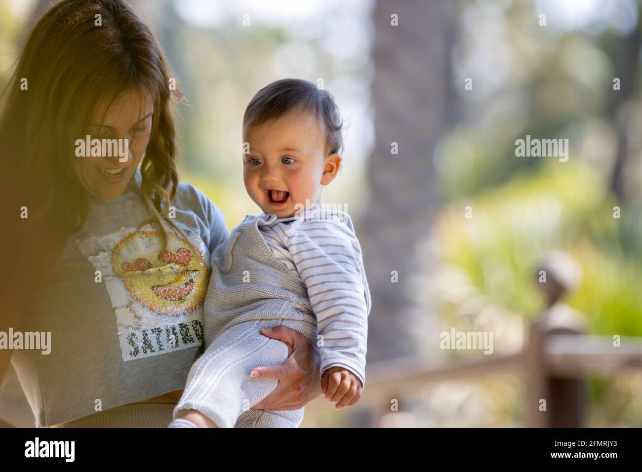 mom hugging her baby and laughing Stock Photo - Alamy