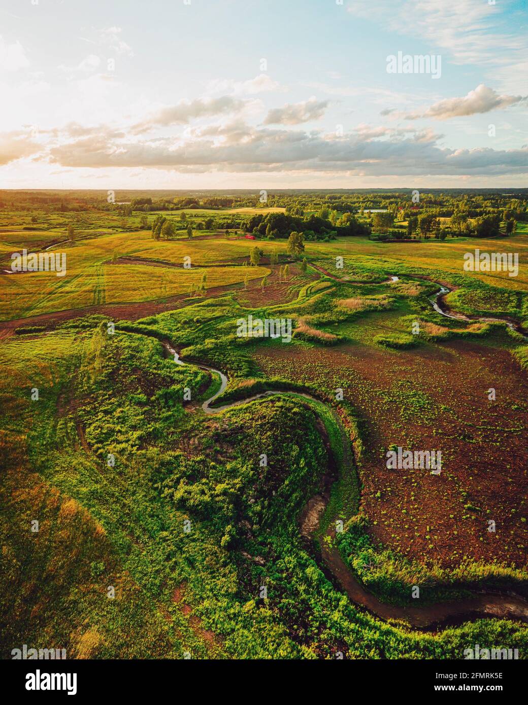 Aerial view of the green Latvian field at sunset time Stock Photo - Alamy